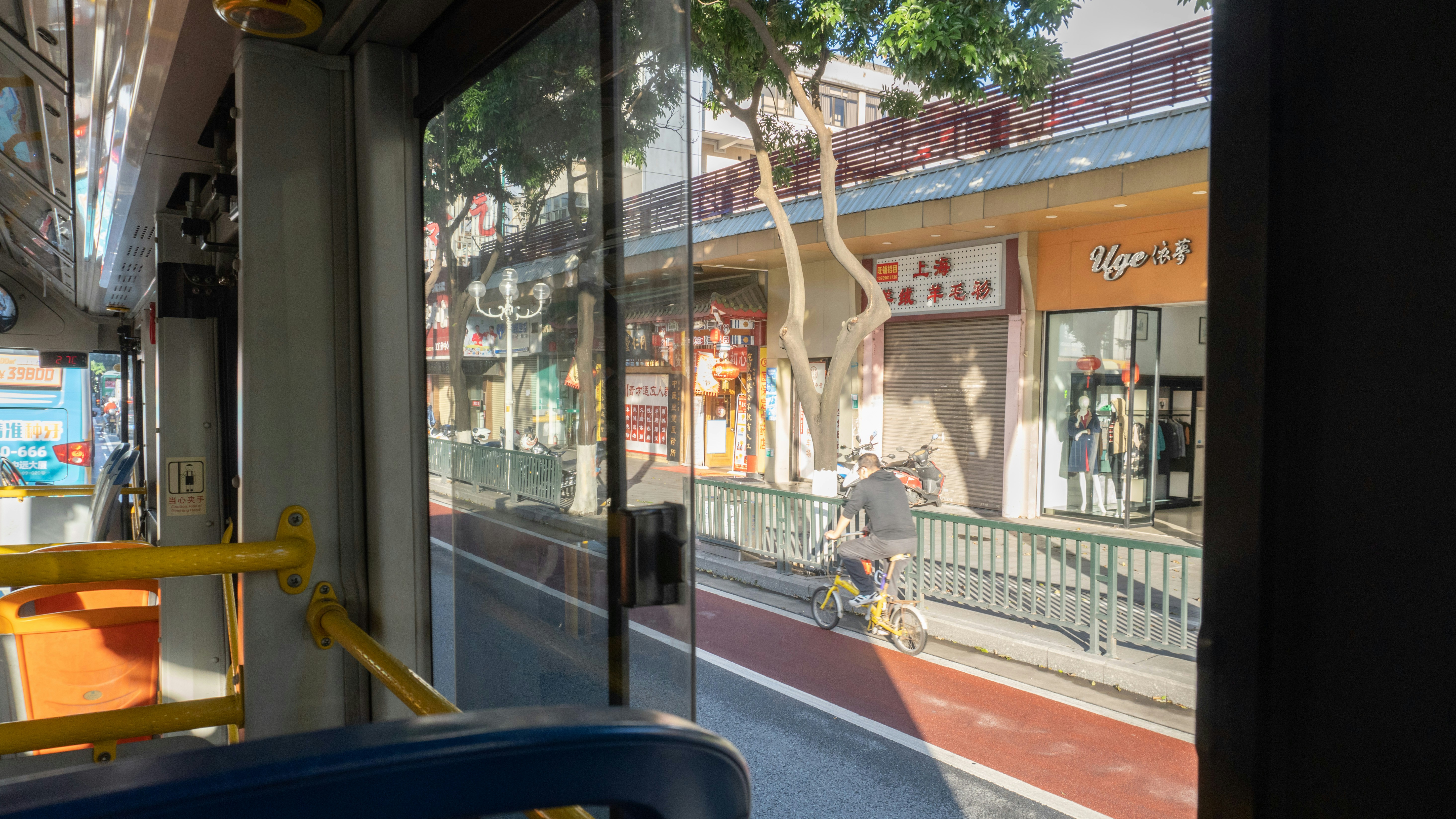 a man riding a bike on a city street