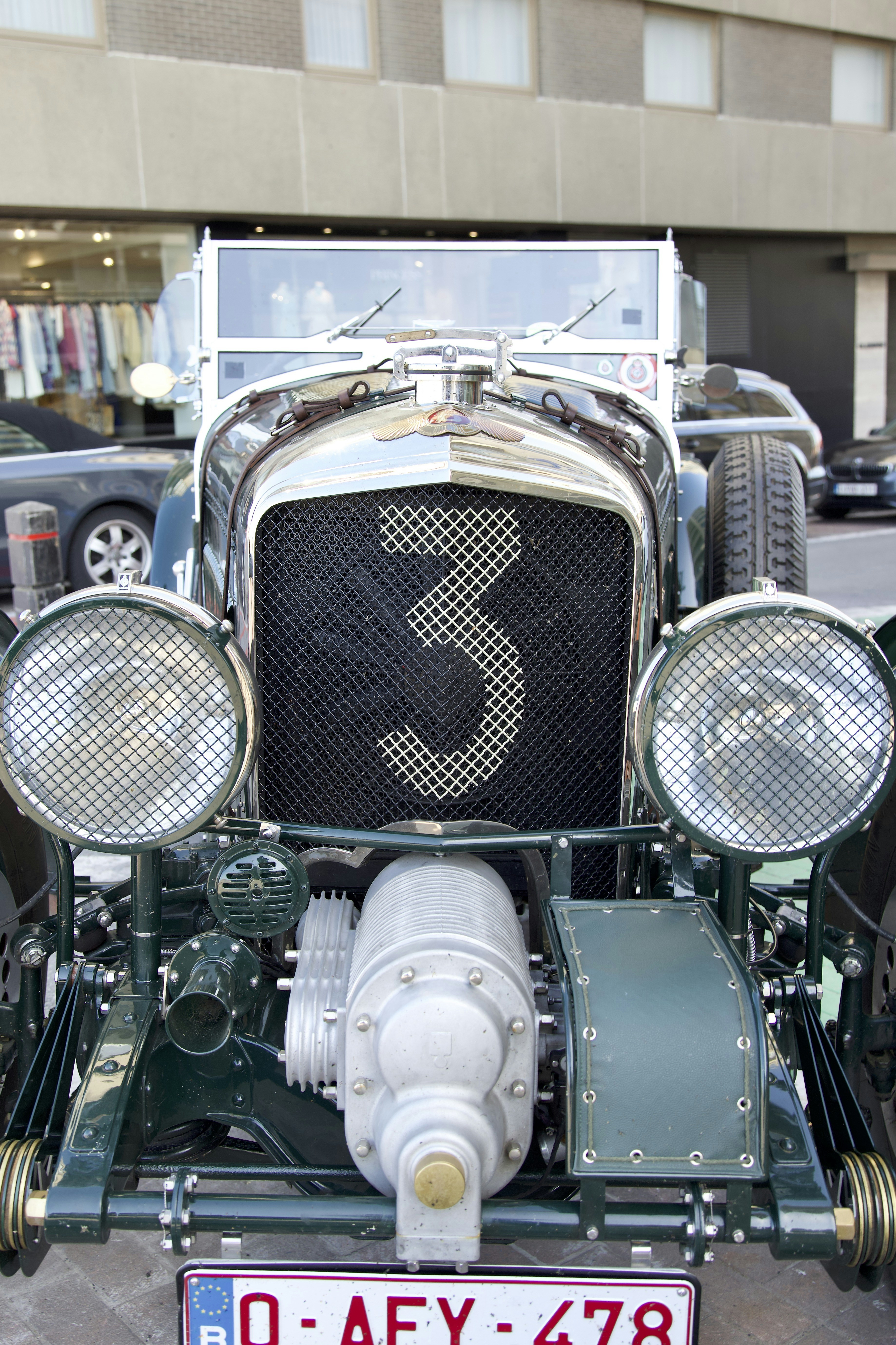 Chrome Regal: Front View of a Vintage Car with Bold Number Grill