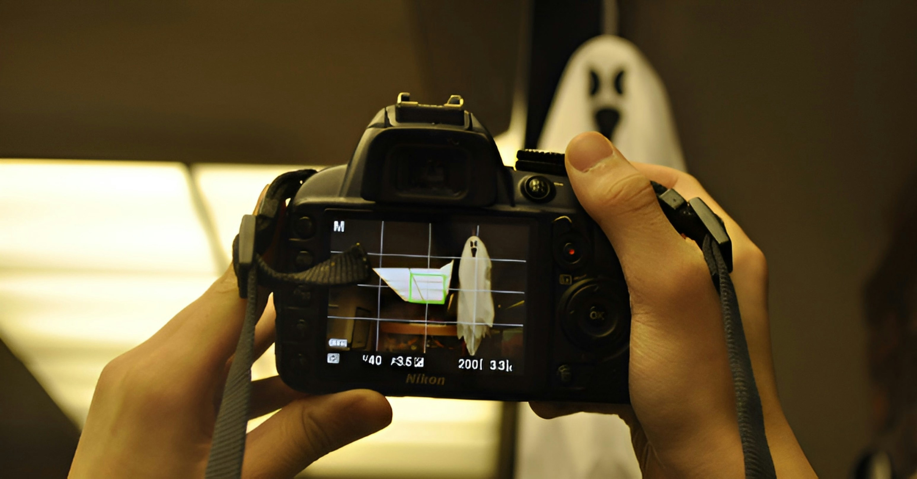 A person taking a picture of a ghost with a camera photo – Free ...