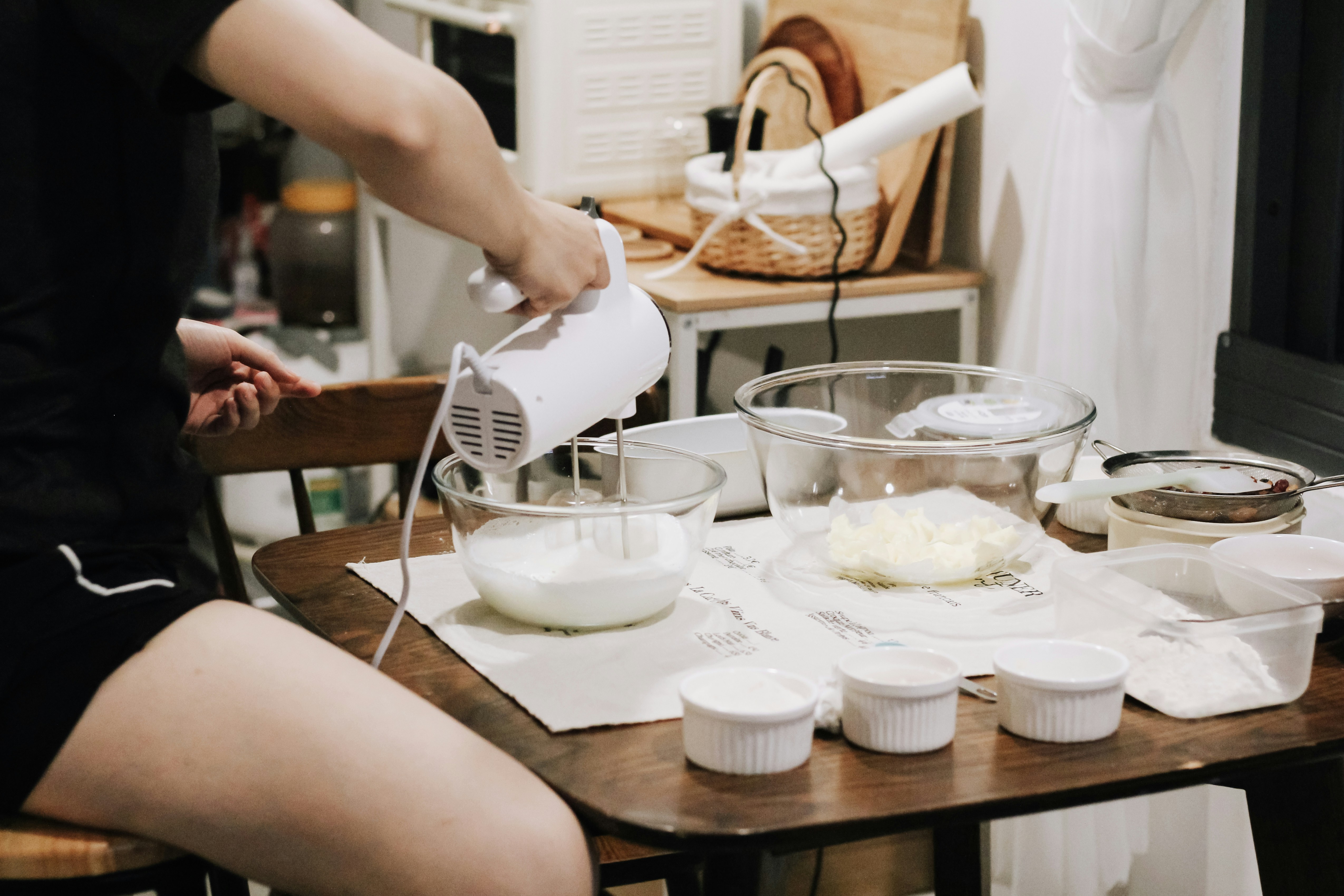 A person is mixing something on a table photo – Free Baking Image on ...