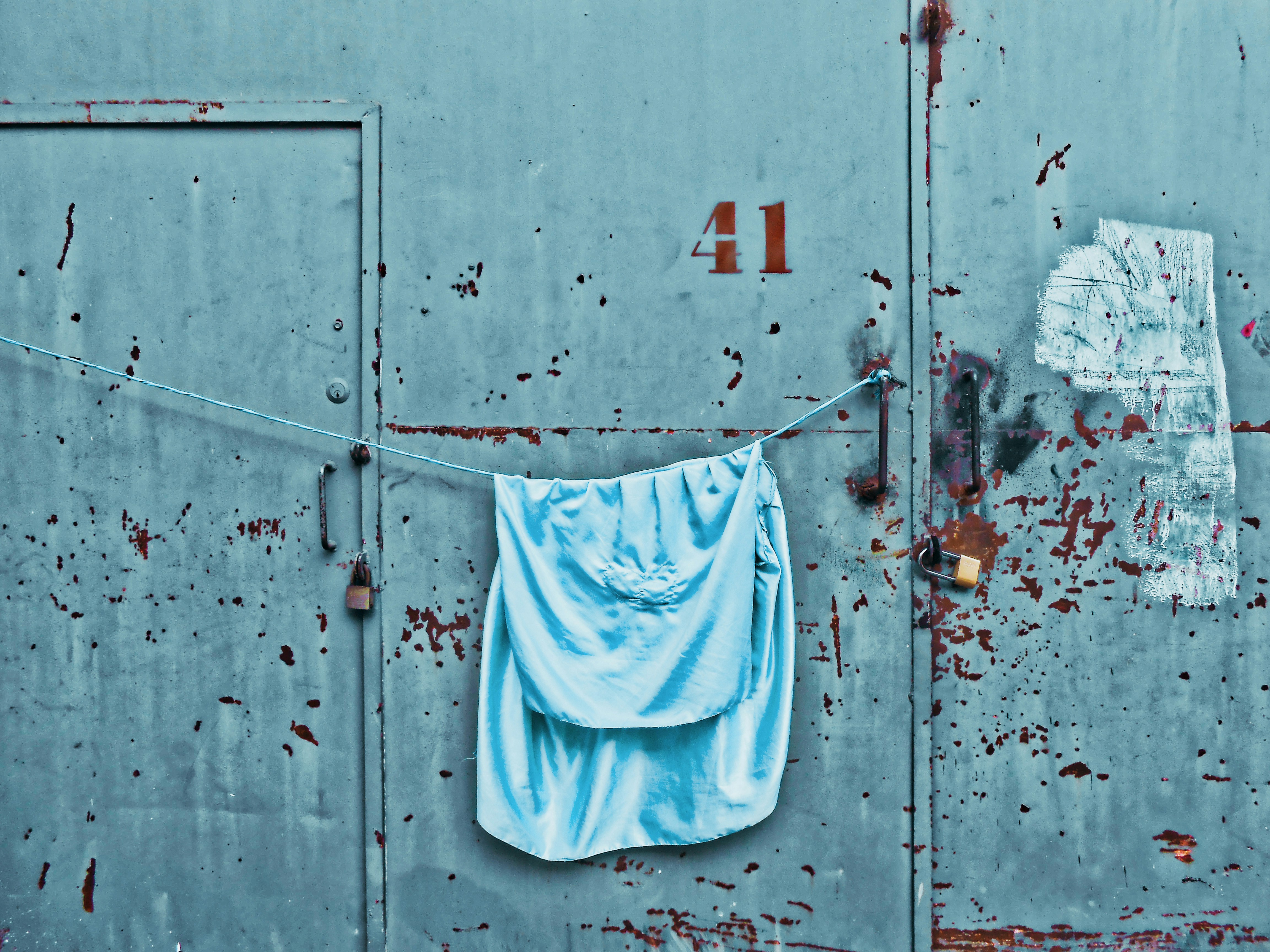 a blue towel hanging on a clothes line