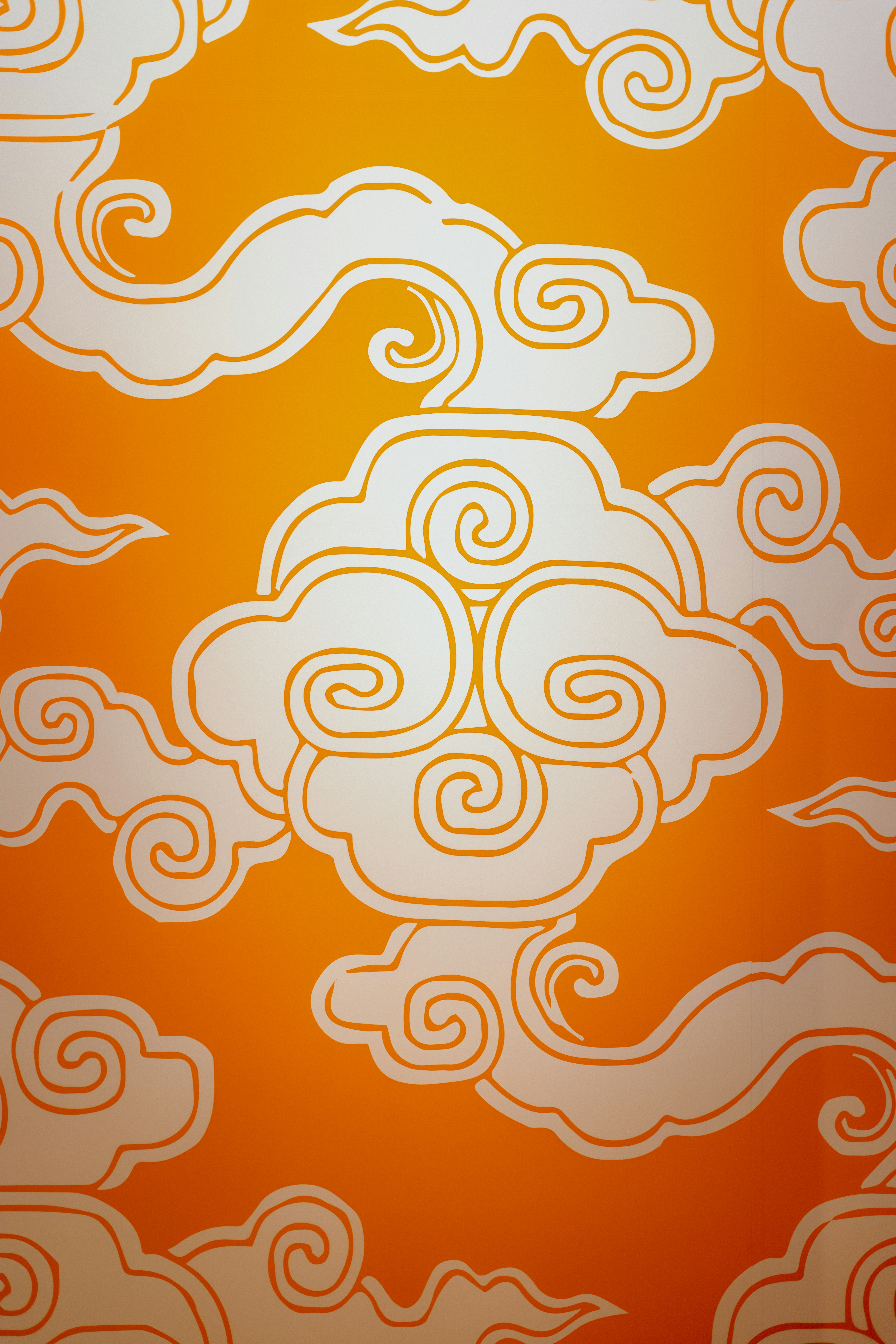 Tangerine Cloudwork: Swirled Cloud Outlines on a Bright Orange Field