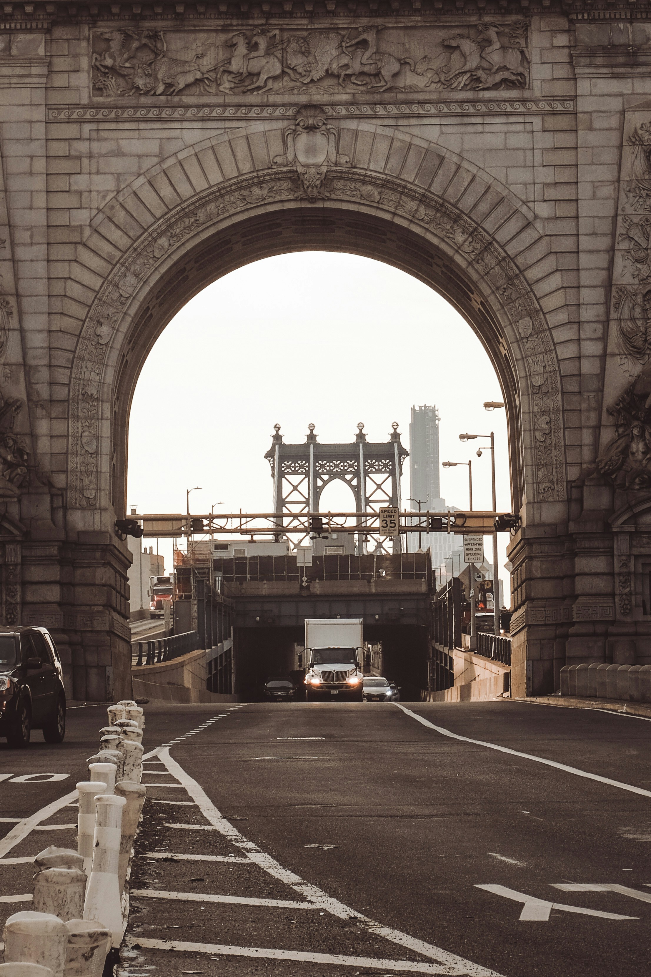 A car driving under an overpass on a city street photo – Free New york ...