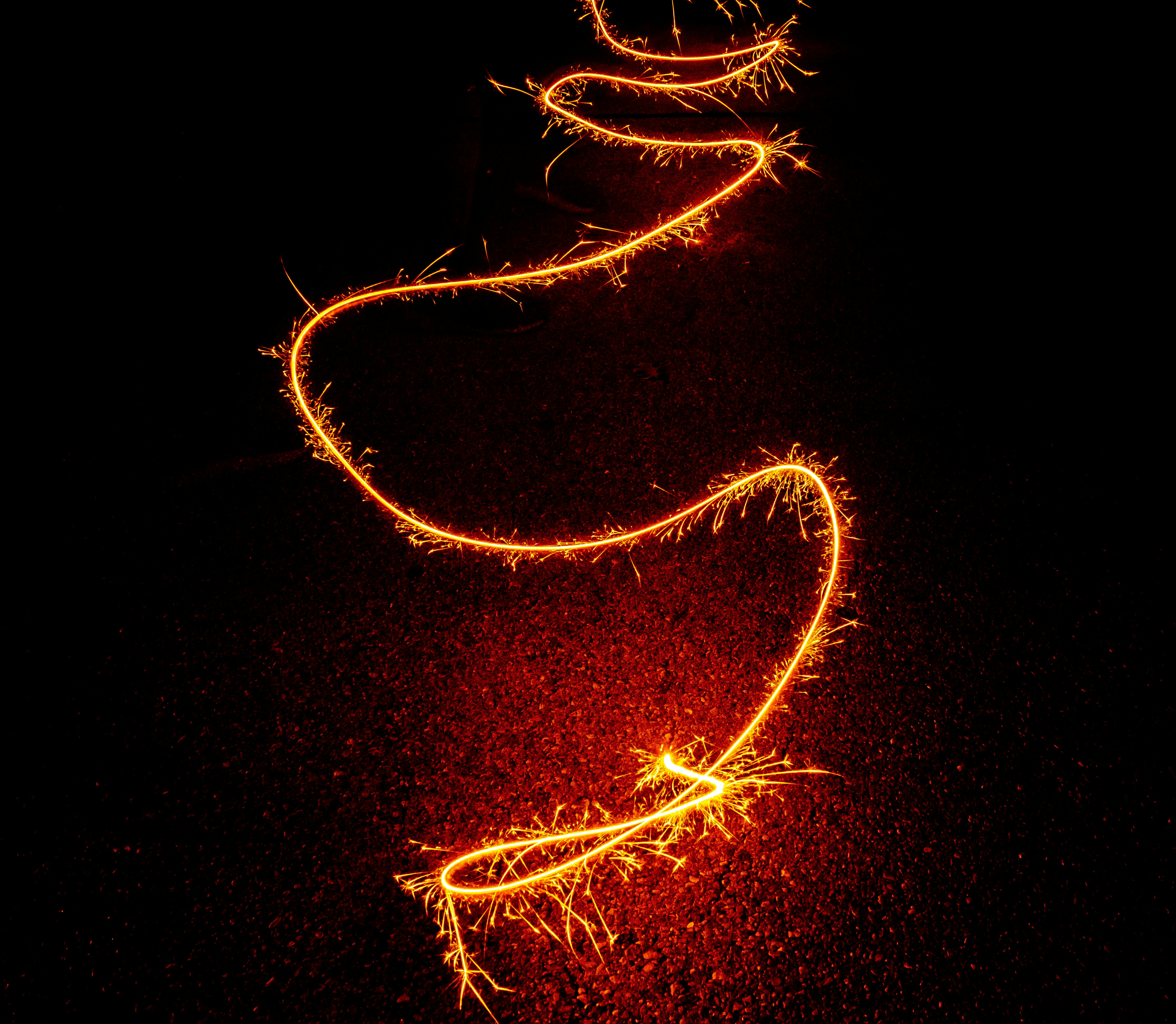 Spiral of Flame: A Neon Ribbon of Fire Across Darkness
