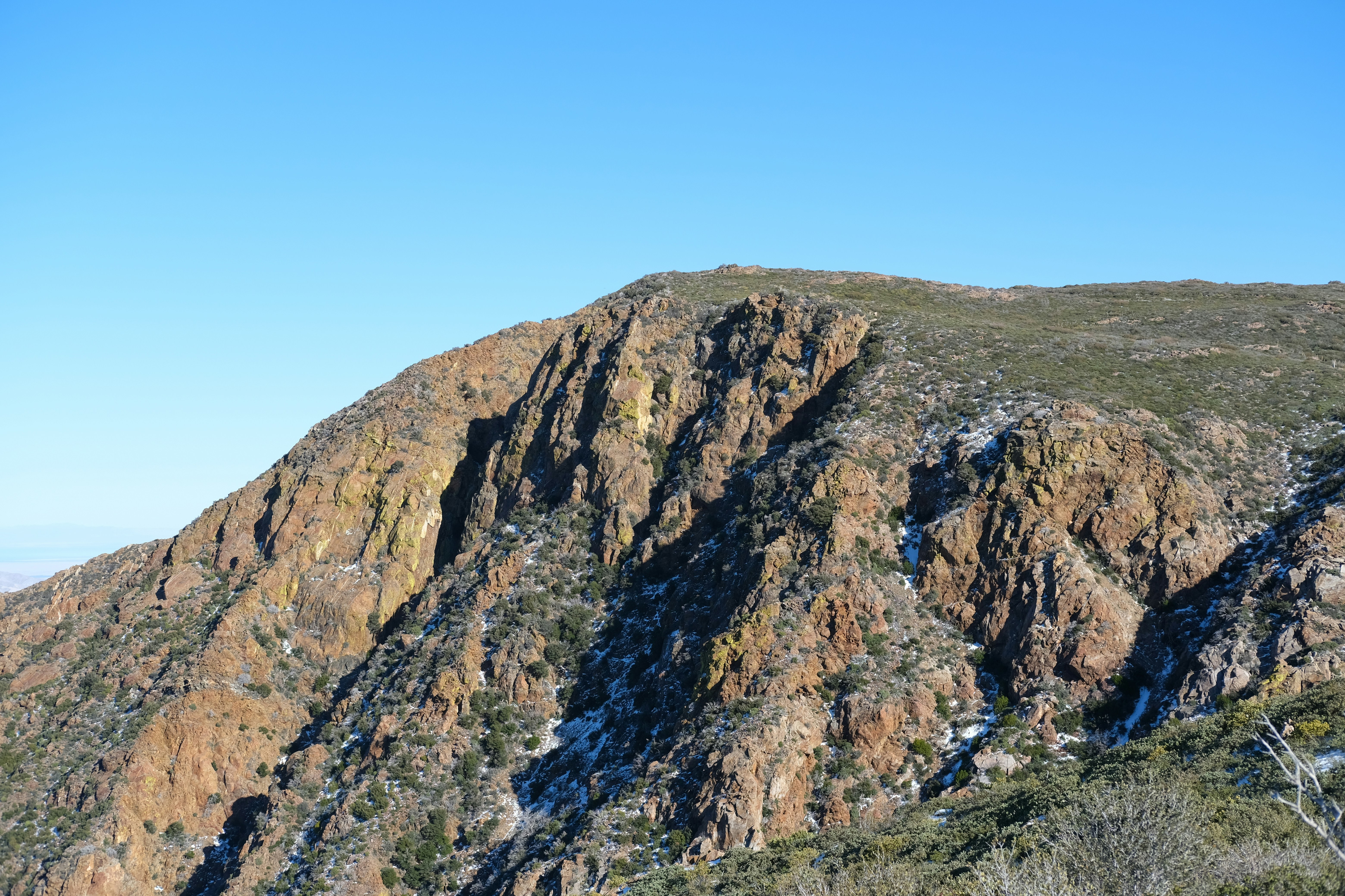 A very tall mountain with a very steep face photo – Free Rock Image on ...
