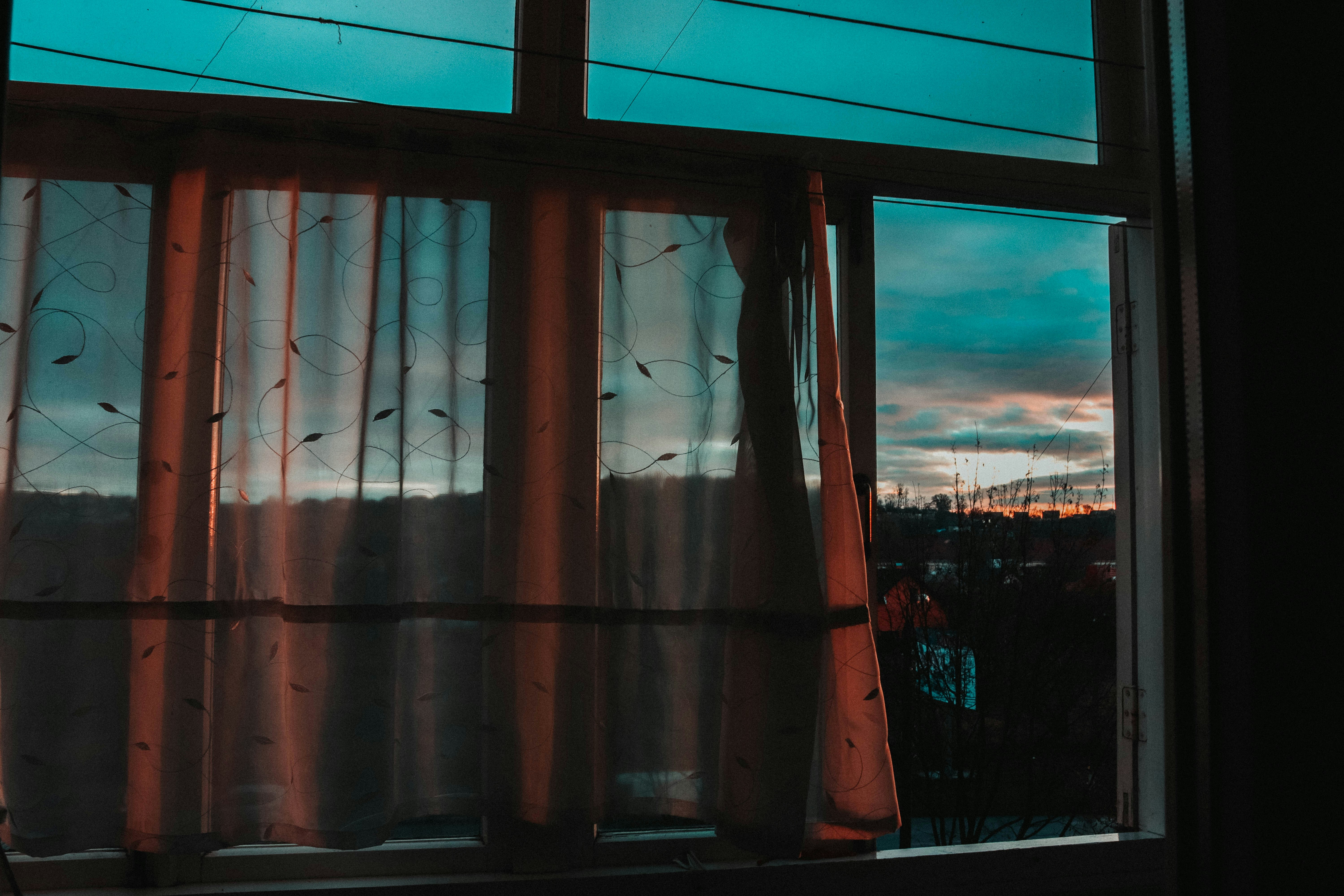 A view of a sunset through a window photo – Free Whinter nature Image ...
