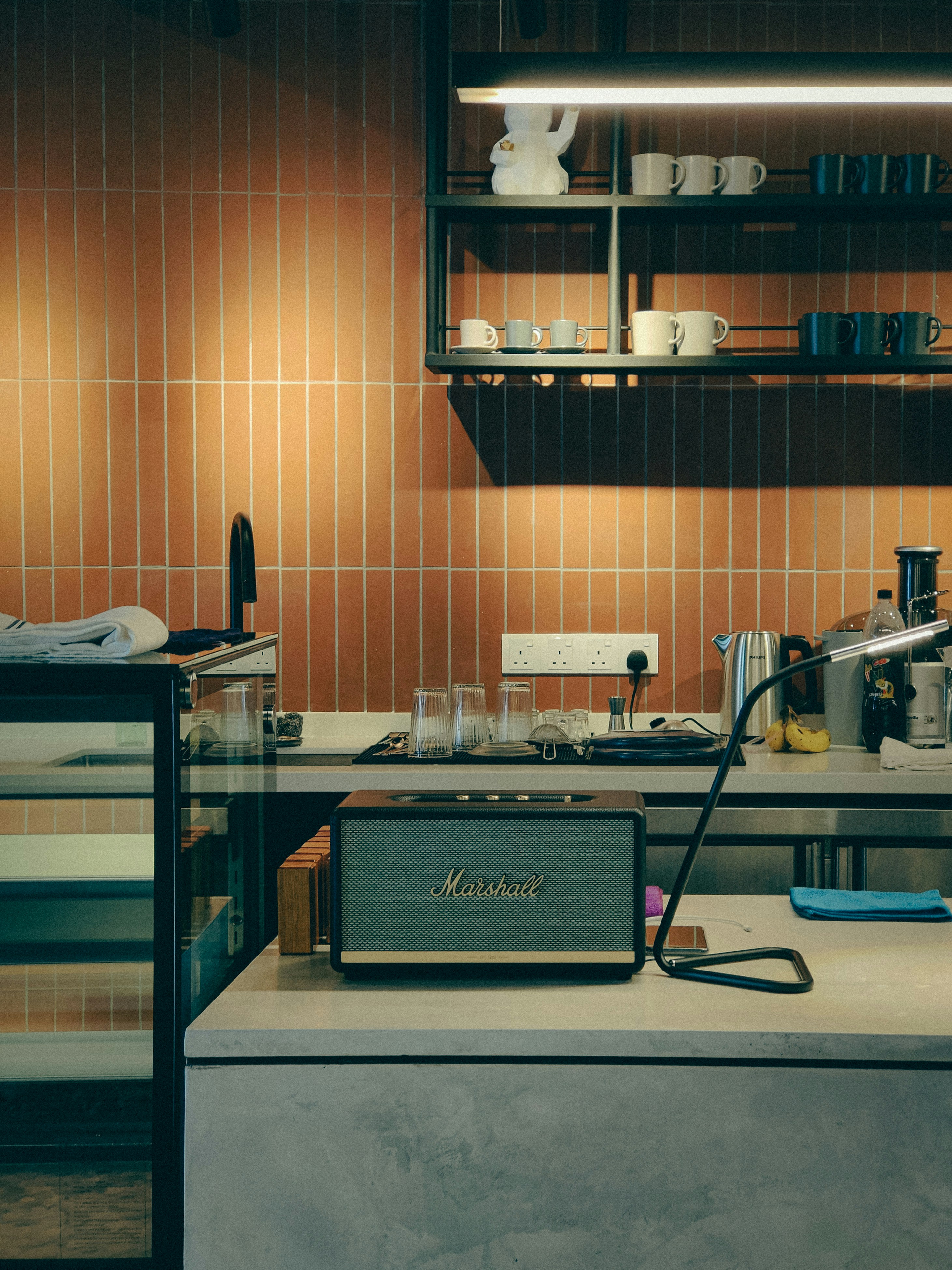 a kitchen with a stove top oven sitting on top of a counter