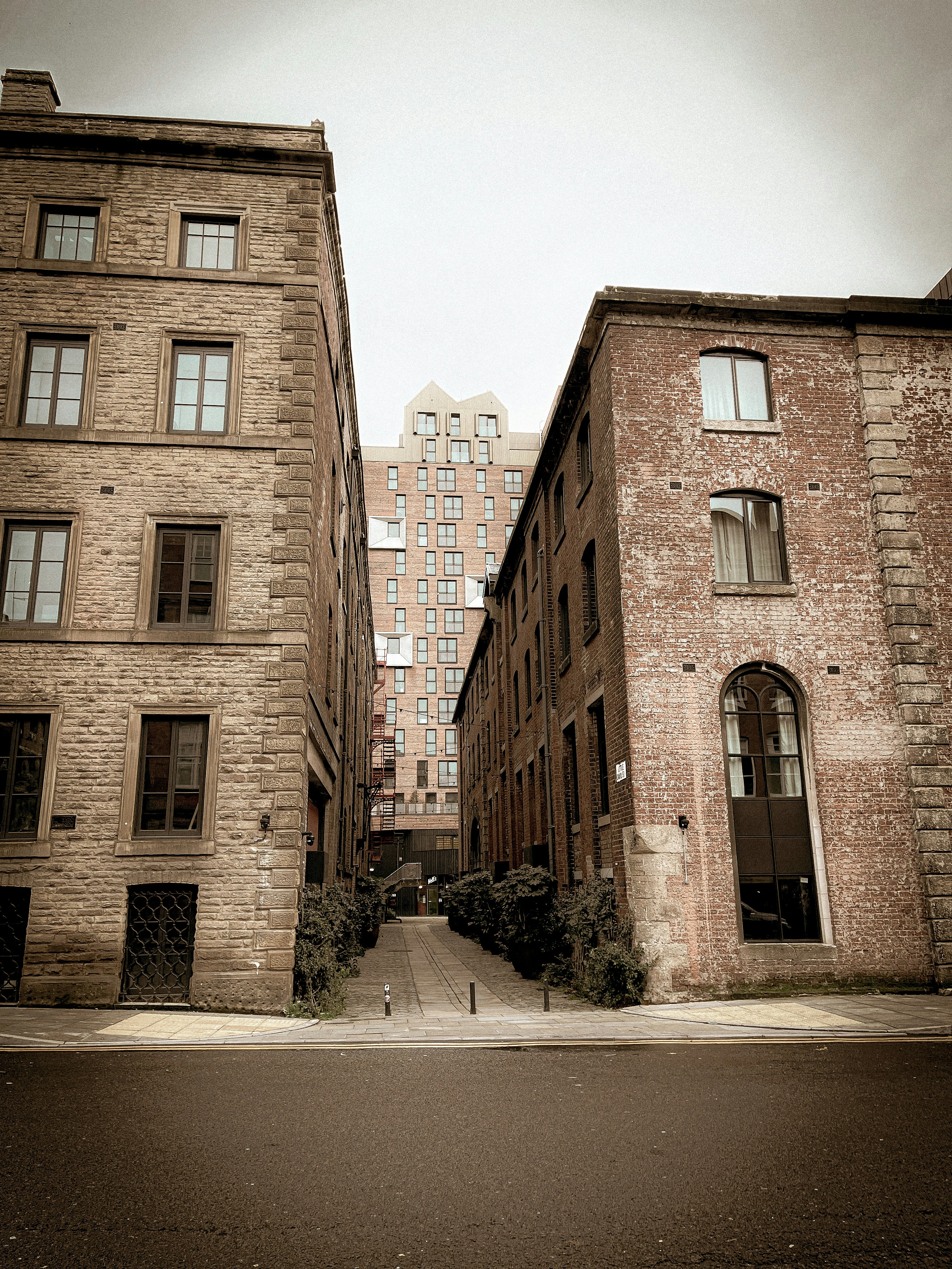 Brick Alley to a Glass Horizon: A City’s Quiet Convergence