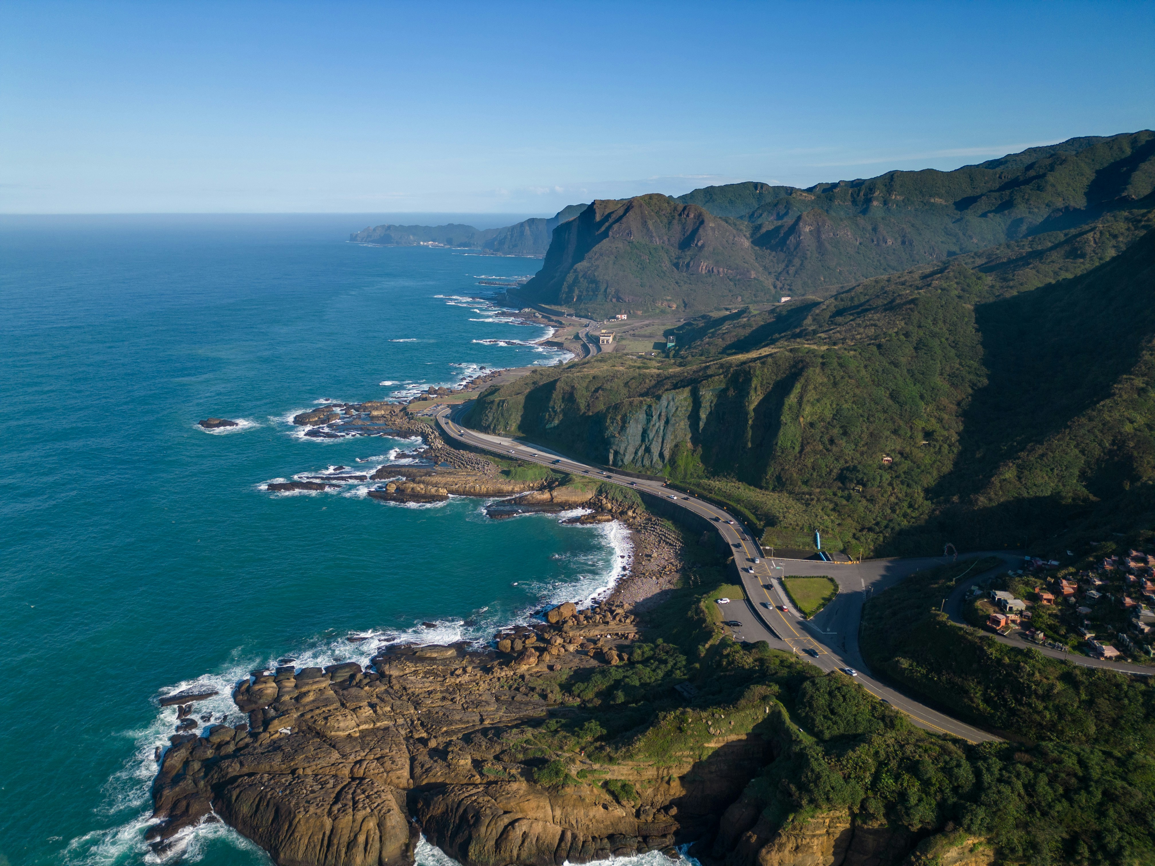 An aerial view of a road near the ocean photo – Free Coast Image on ...