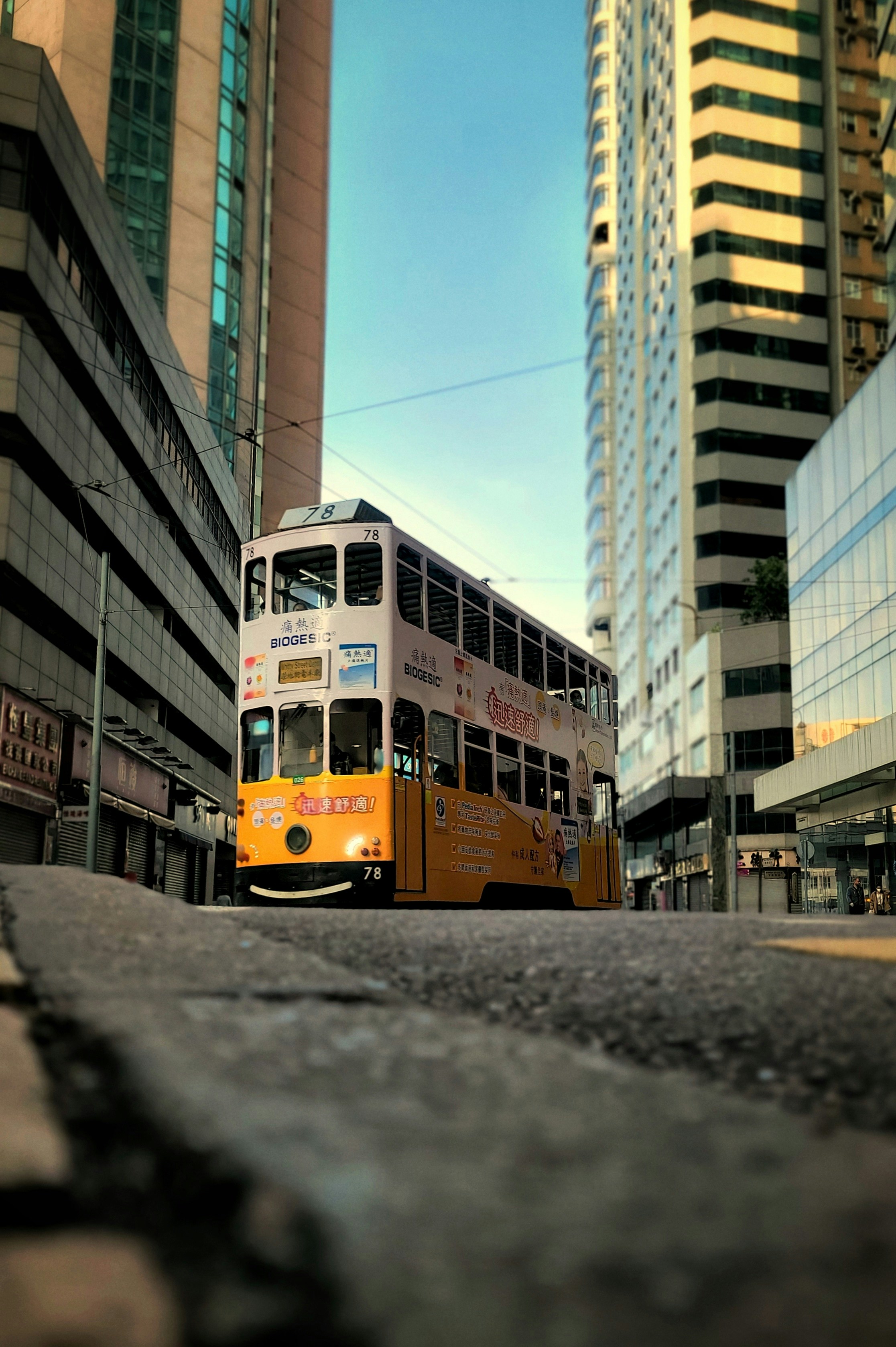 City Tram Confluence: A Yellow Streetcar against a Glassy Skyline