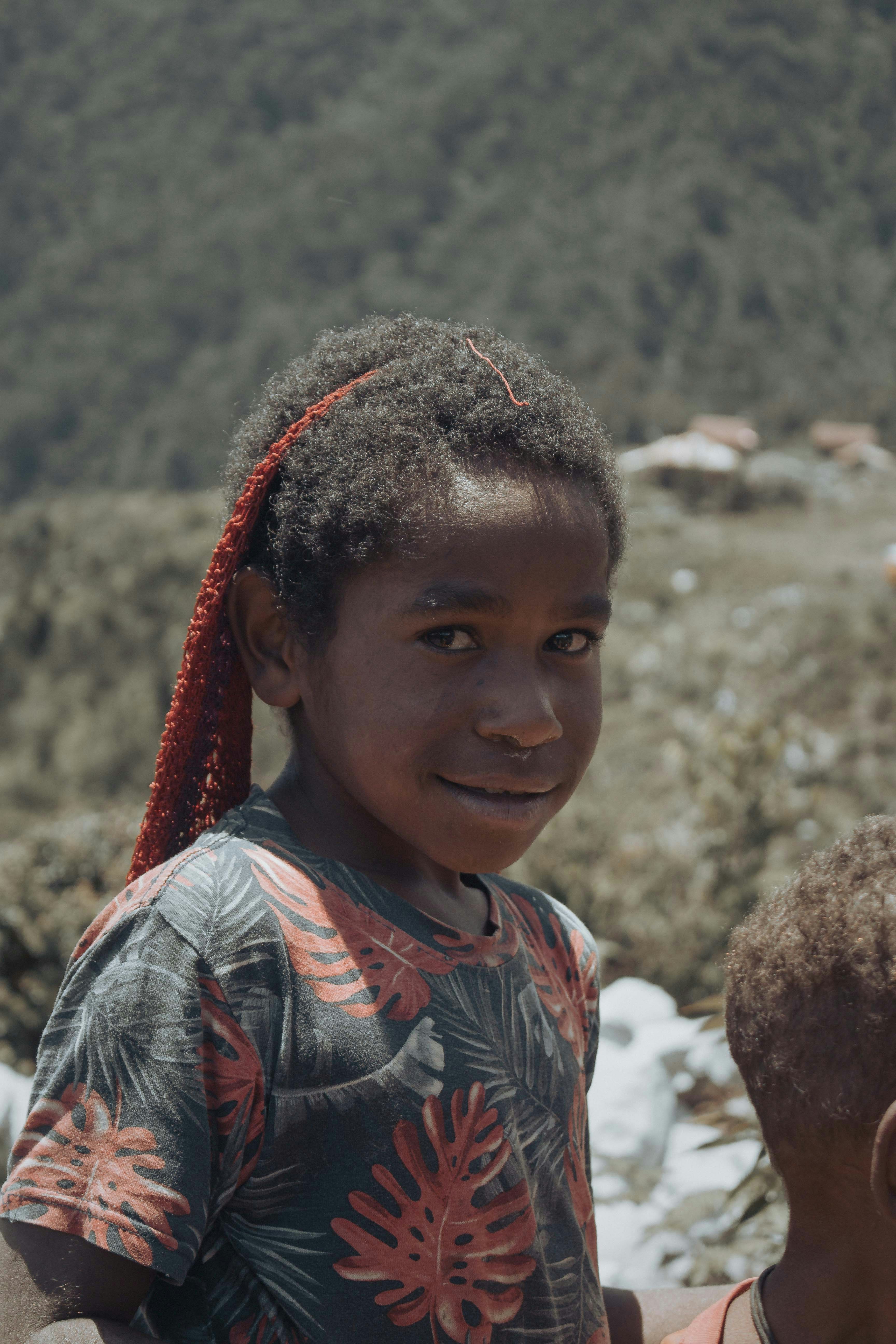 A little girl standing next to a little boy photo – Free Yahukimo ...