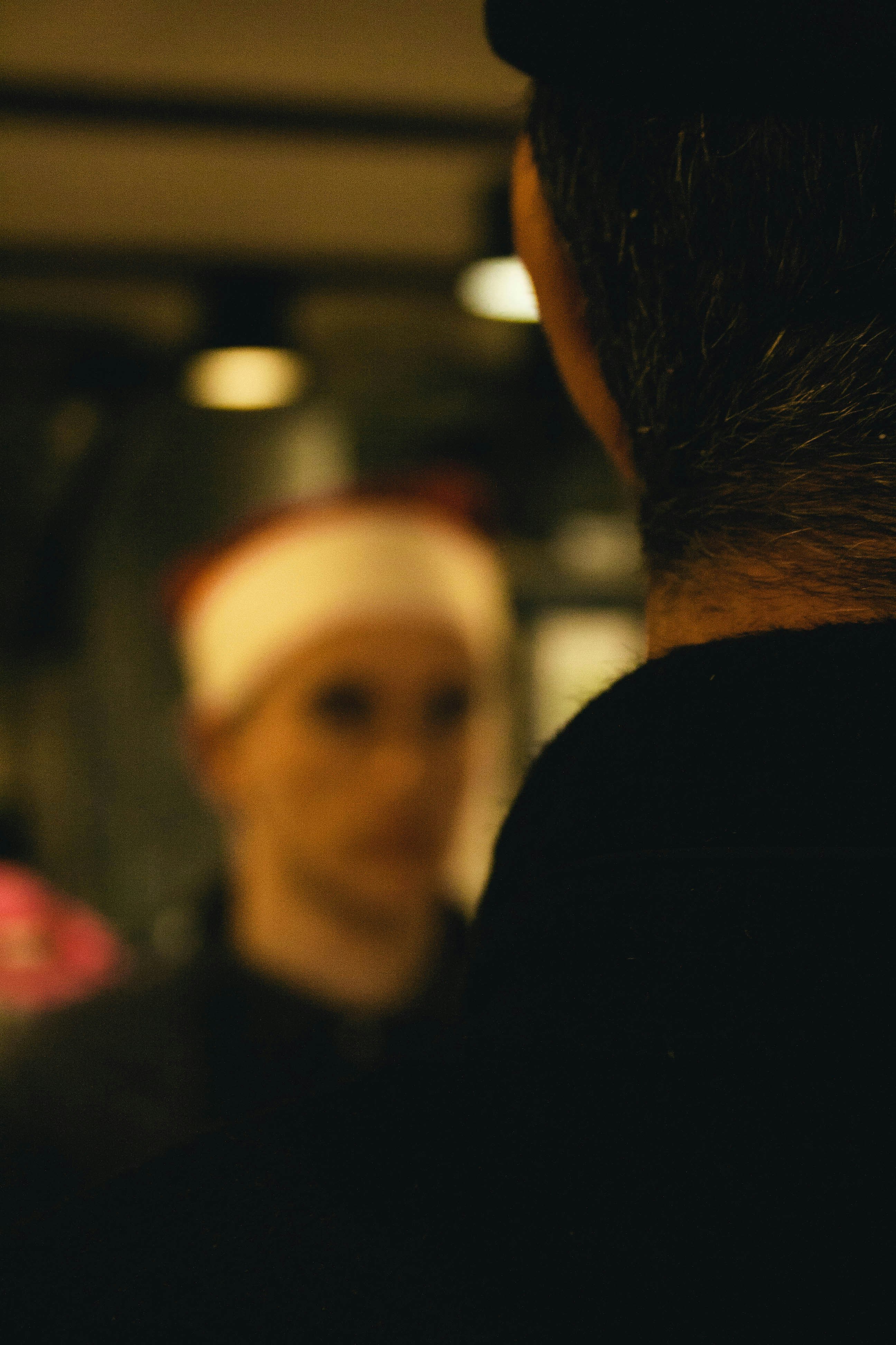 a man wearing a santa hat looking at his cell phone