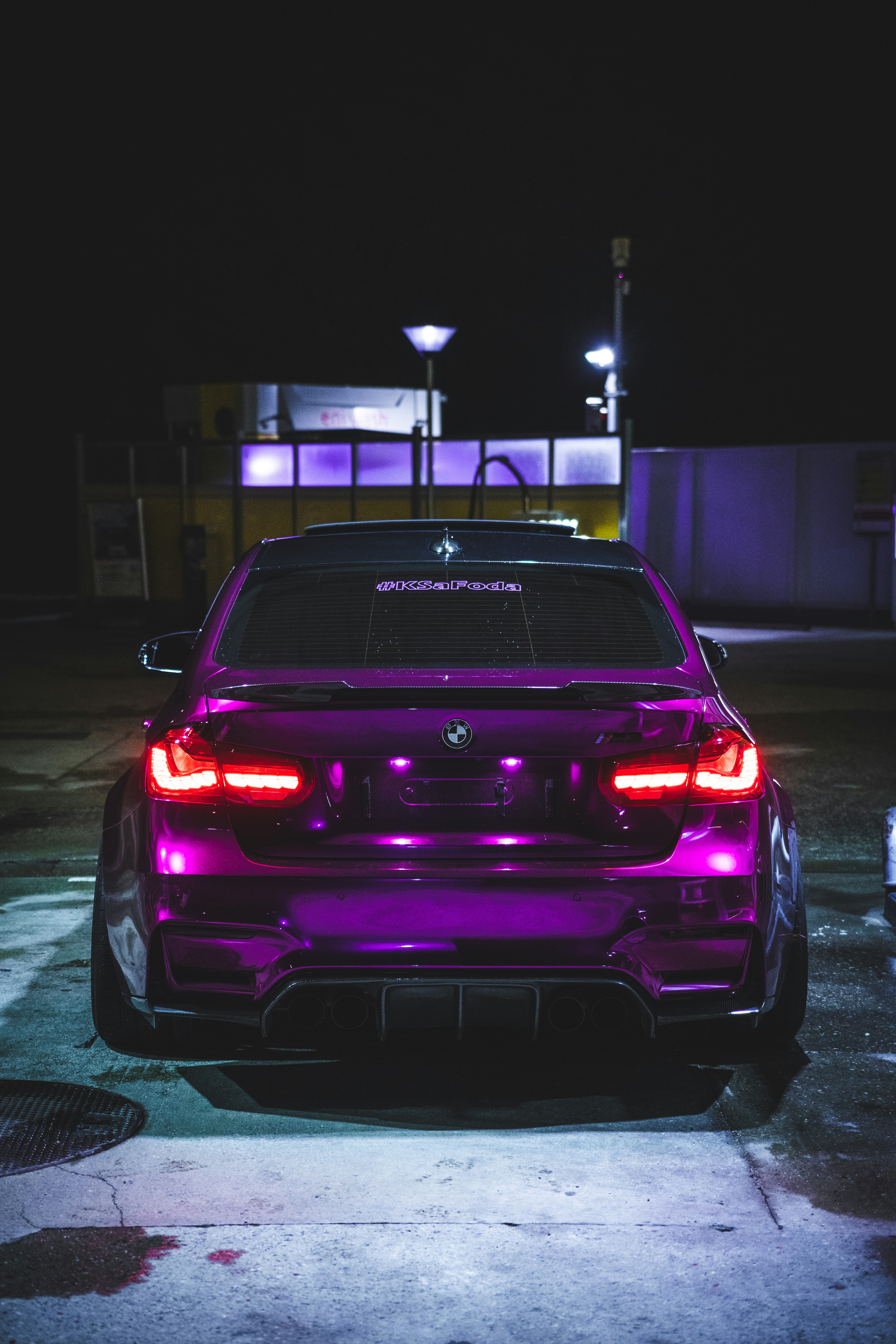 a car parked in a parking lot at night