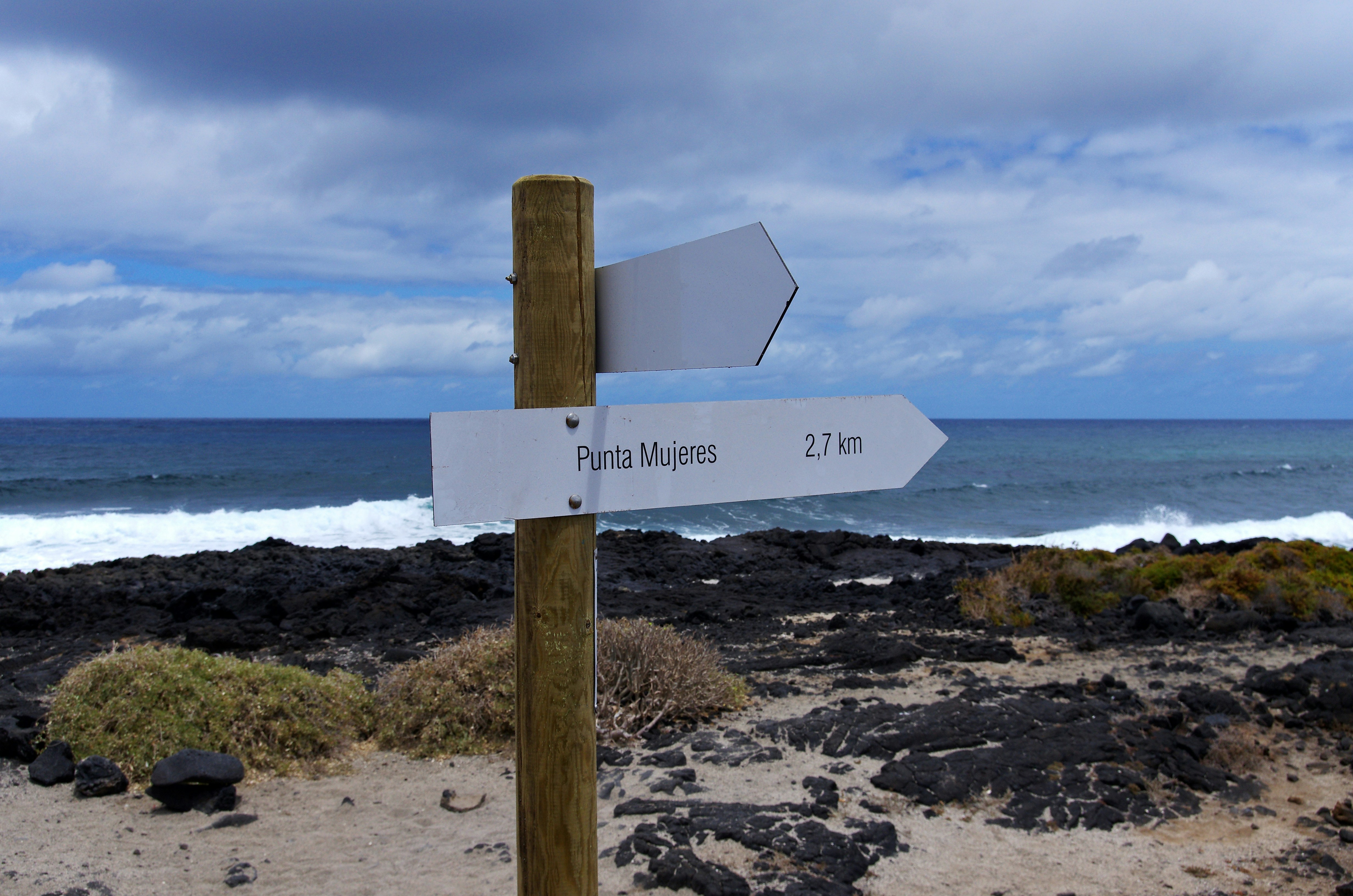 A wooden sign pointing to two different directions photo – Free ...