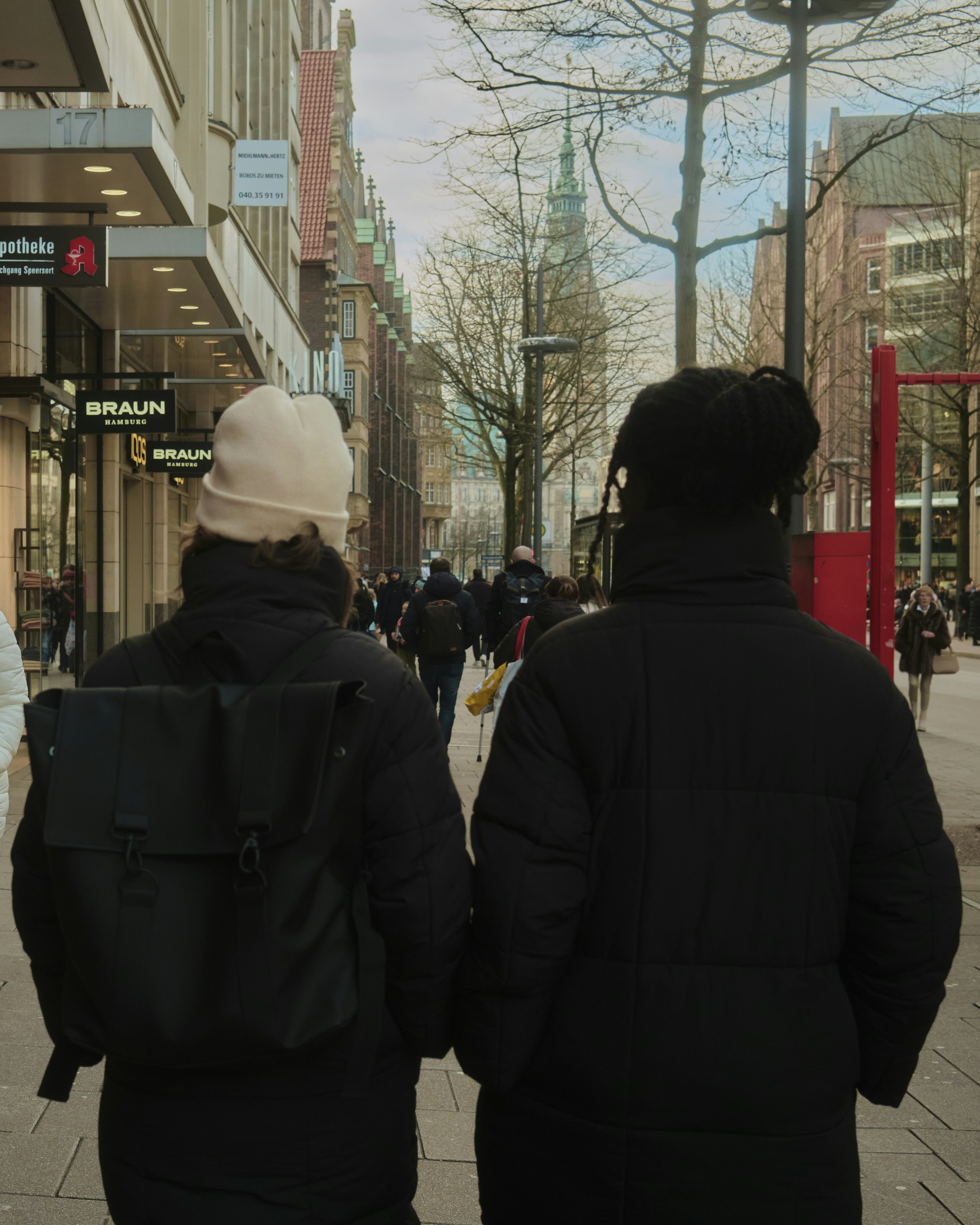 Backs to the City: A Winter Walk on a European Pedestrian Street