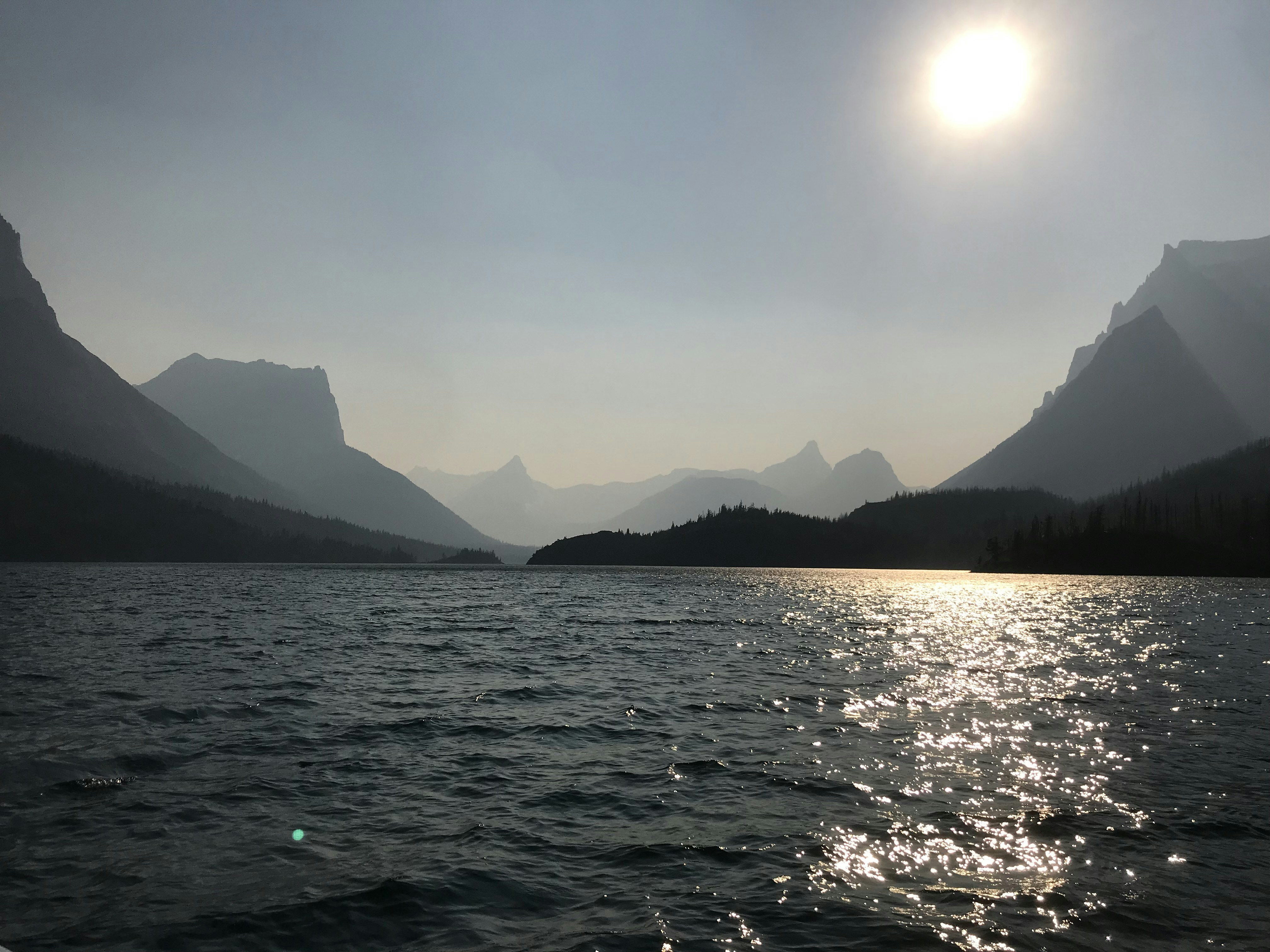 Sunlit Peaks Reflecting on a Quiet Alpine Lake