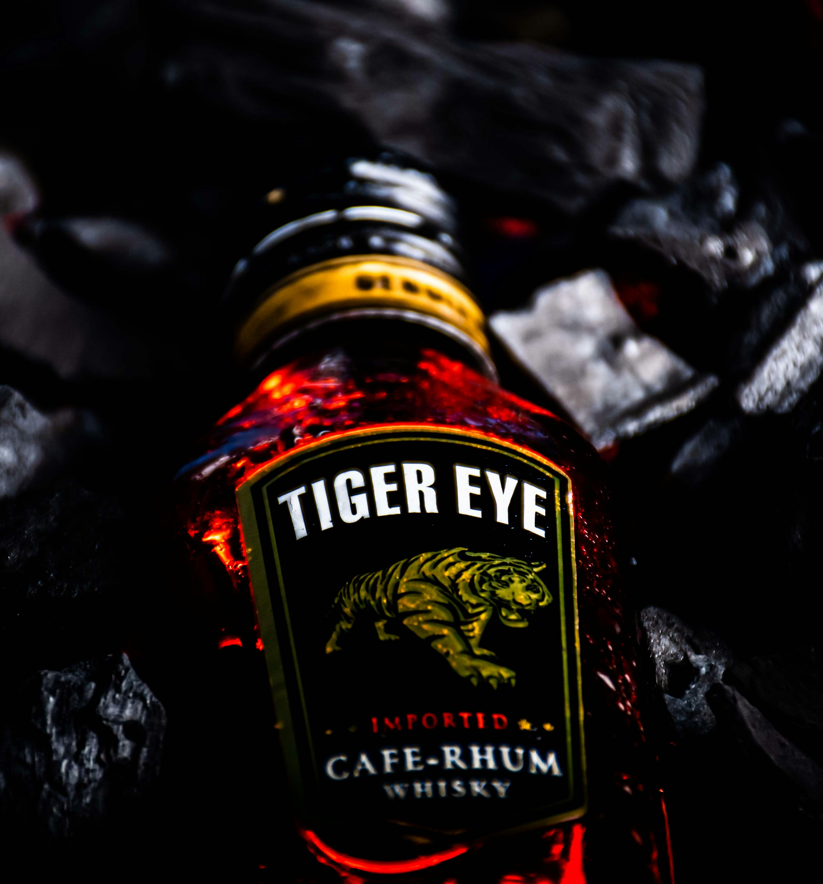 A close up of a bottle of tiger eye photo – Free Alcohol Image on Unsplash