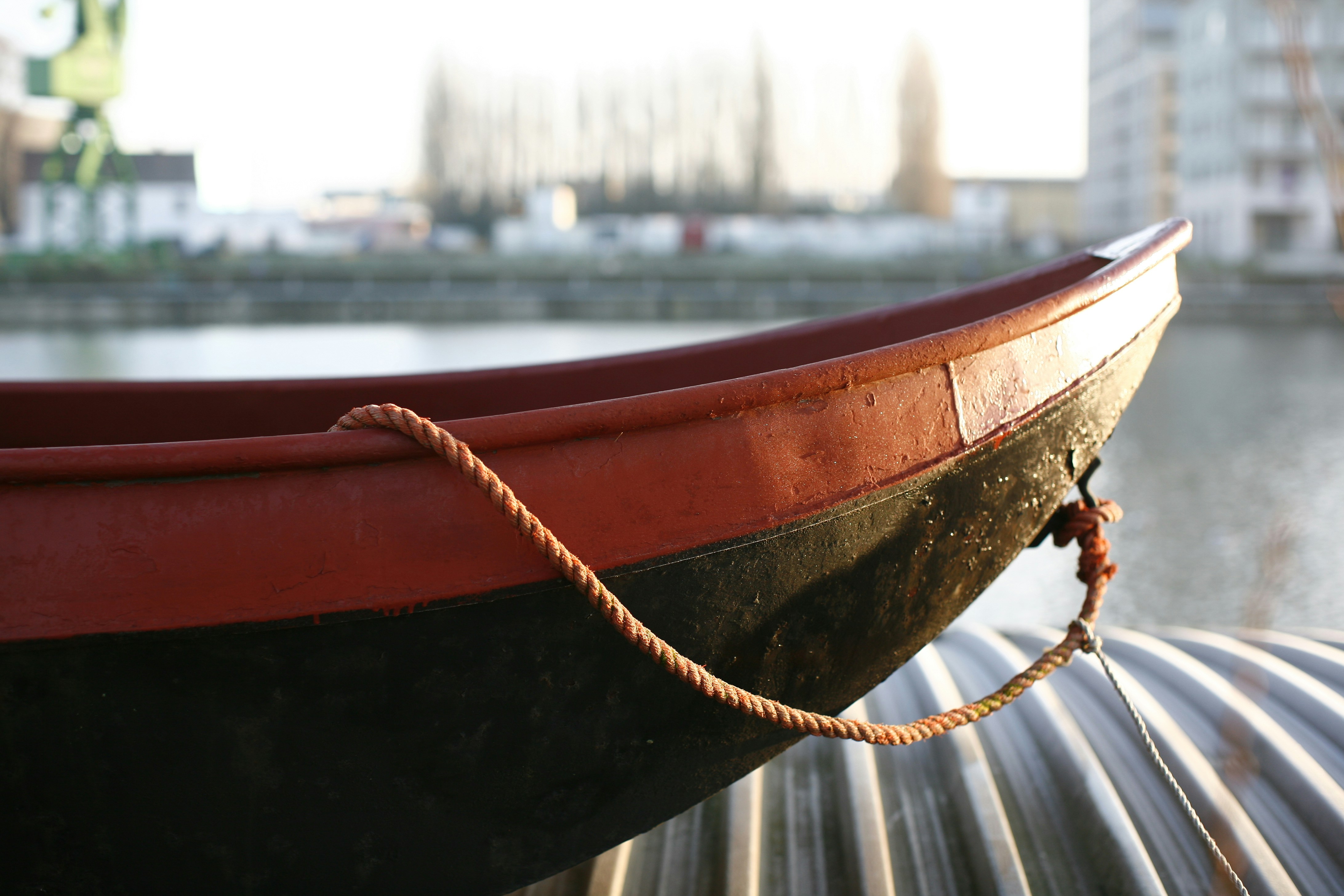 Rope Framing the Red Bow: Quiet Harbor Texture in Soft Light