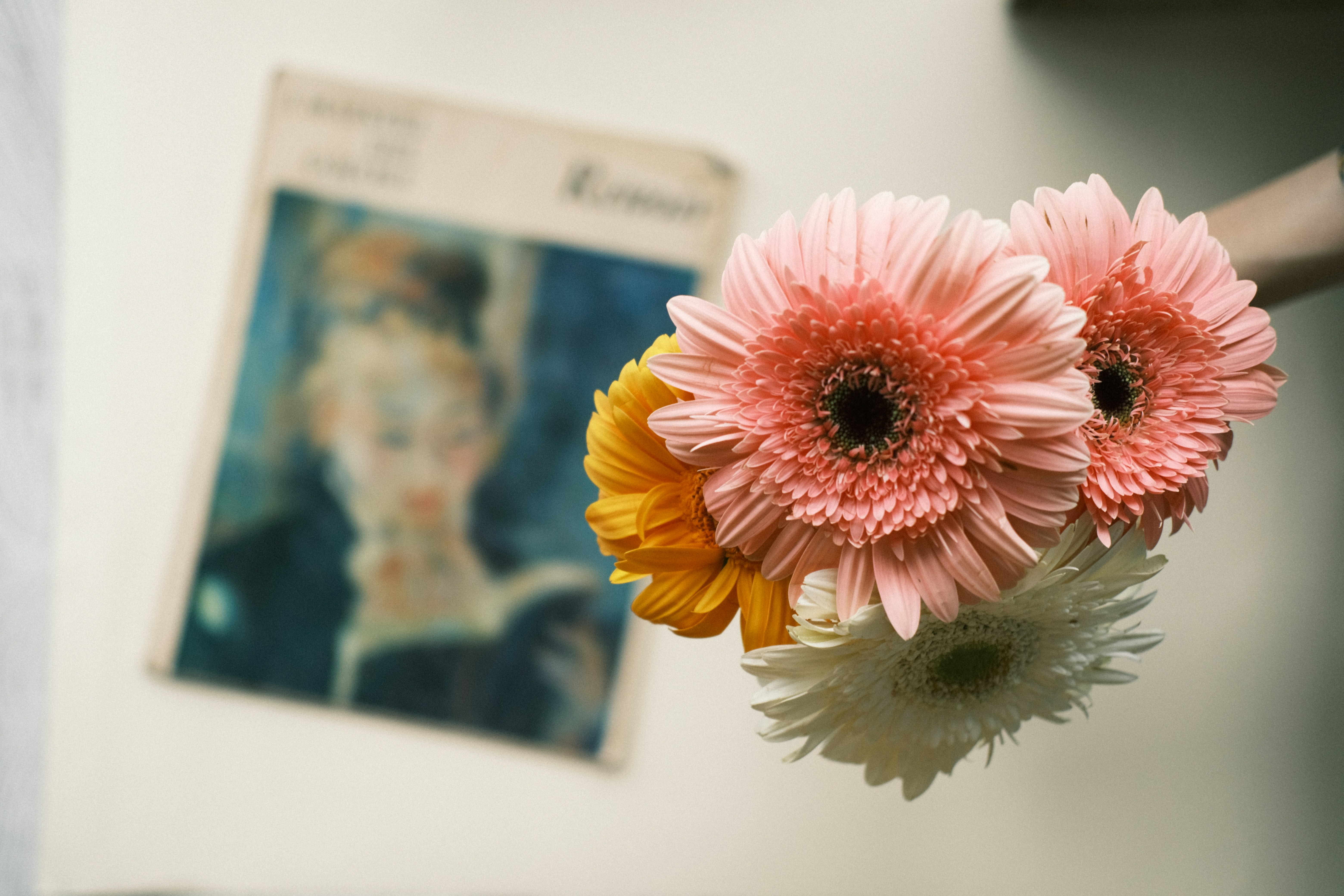 Floral Focus, Retro Blur: A Bouquet Framed by a Distant Portrait