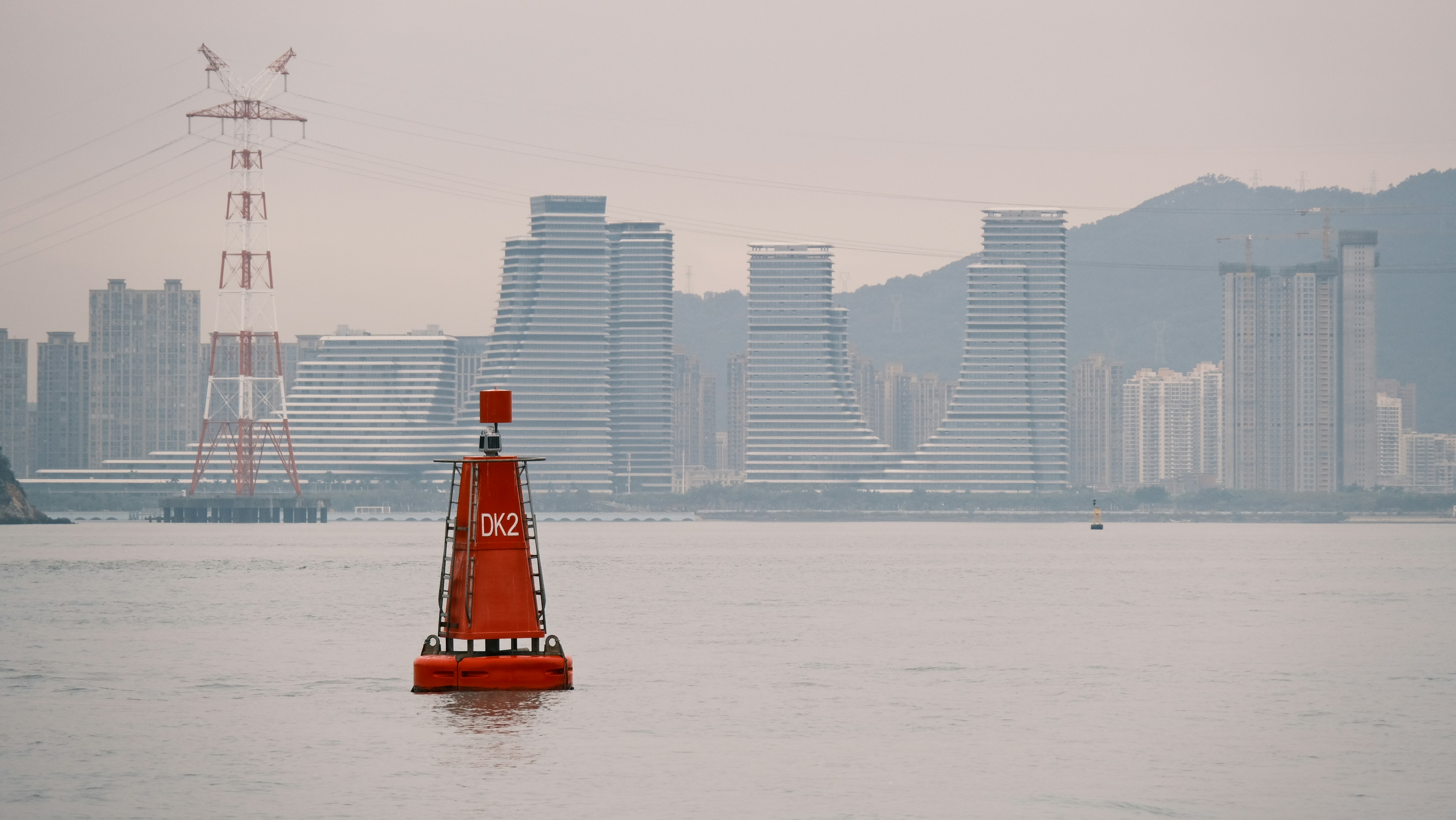 A red buoy floating on top of a body of water photo – Free Xiamen Image ...