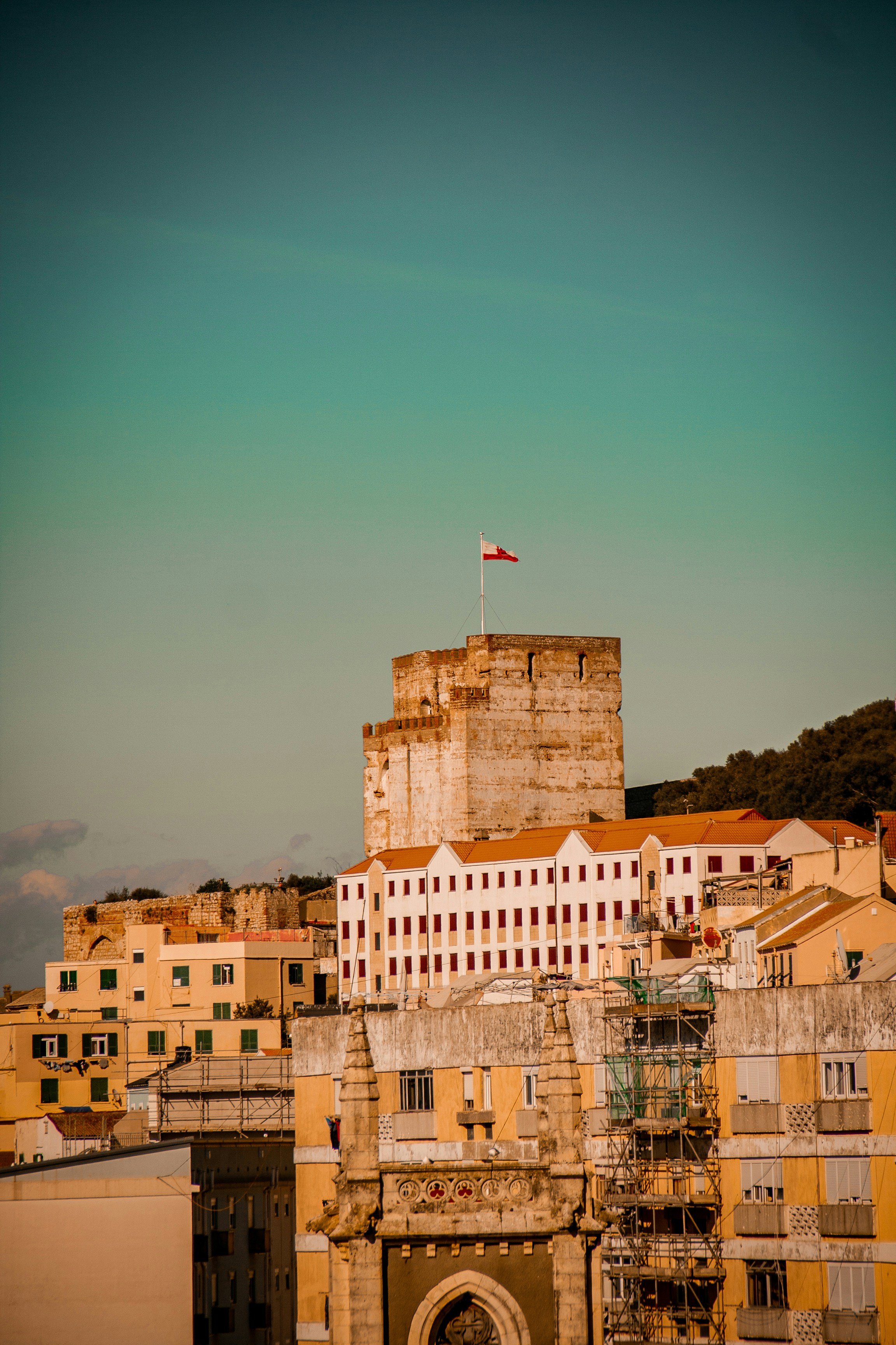Castle Towerwatch Over a Sunlit Harbor Row