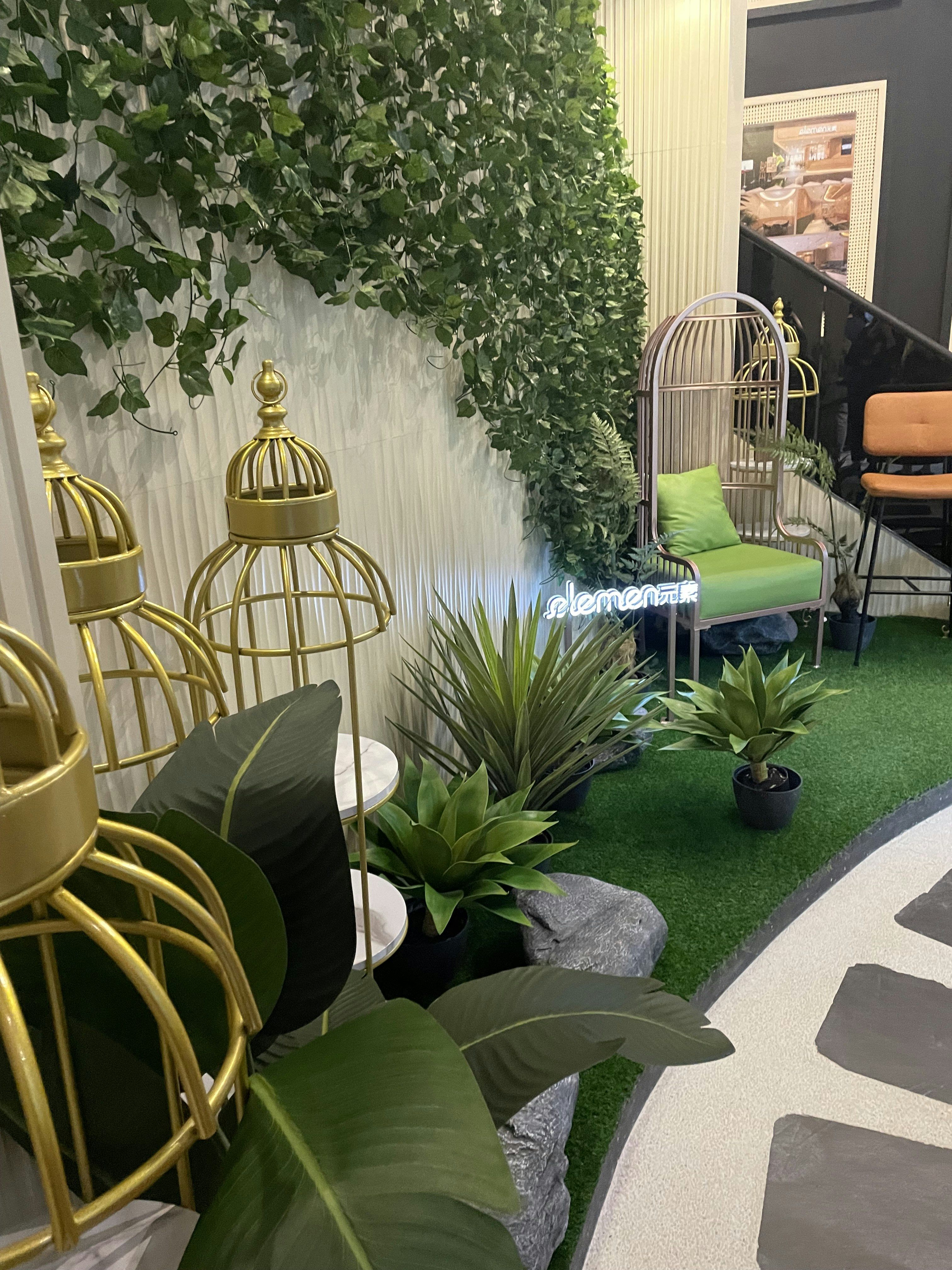 Verdant Lounge: Gold Lanterns, Neon Sign, and a Green Nook