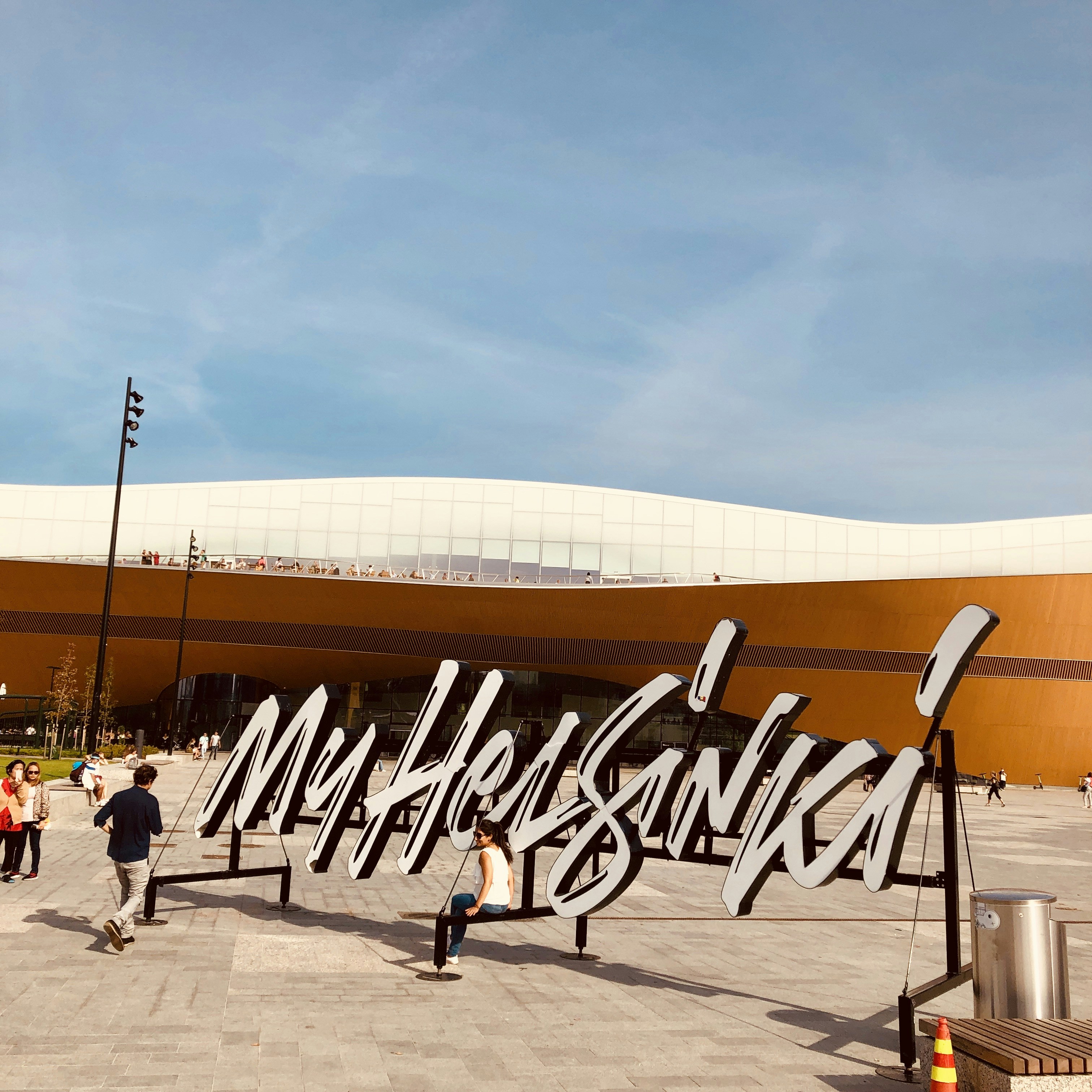 Whimsical Script in a Sunlit Plaza