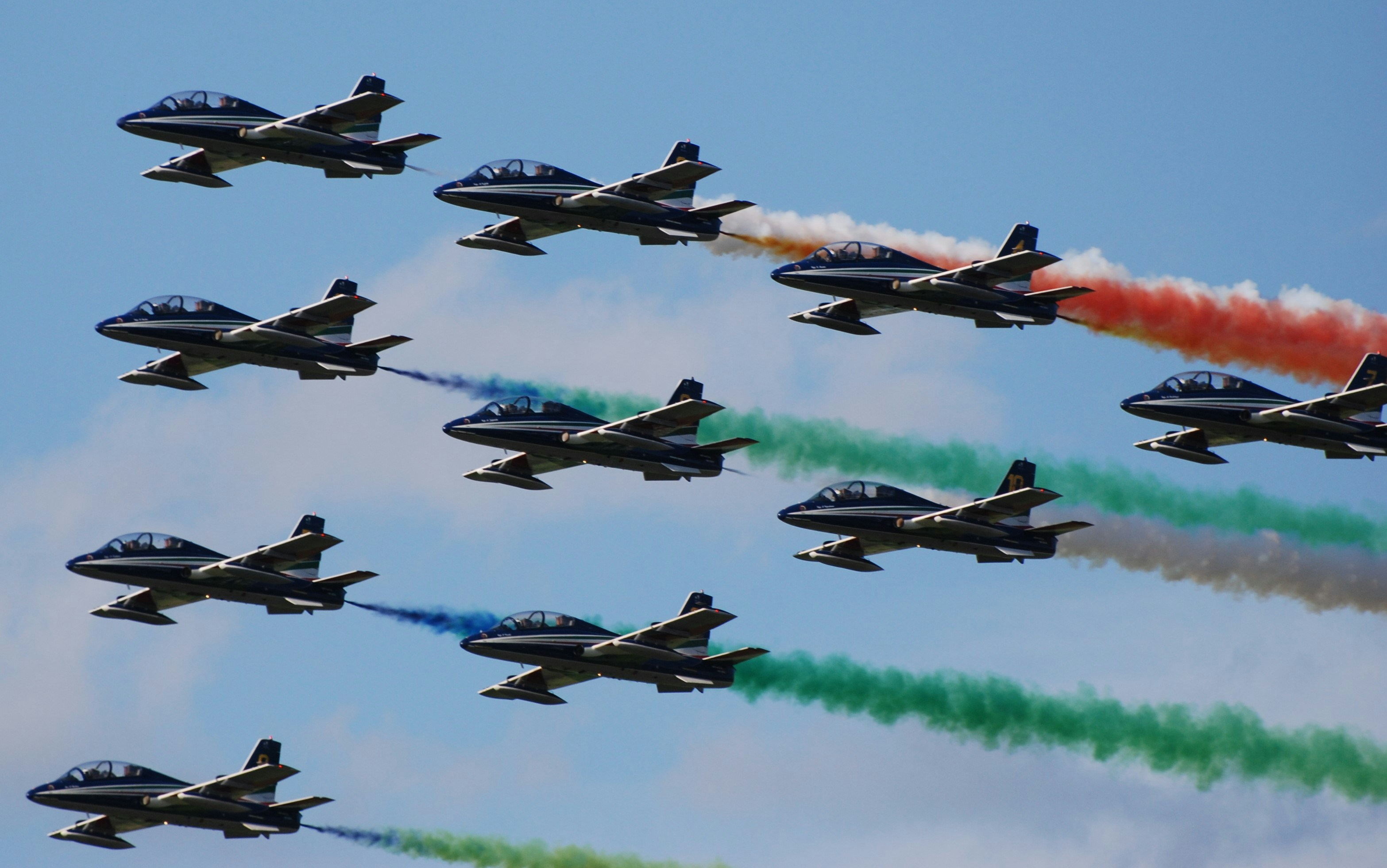 A group of jets flying through a blue sky photo – Free Image on Unsplash