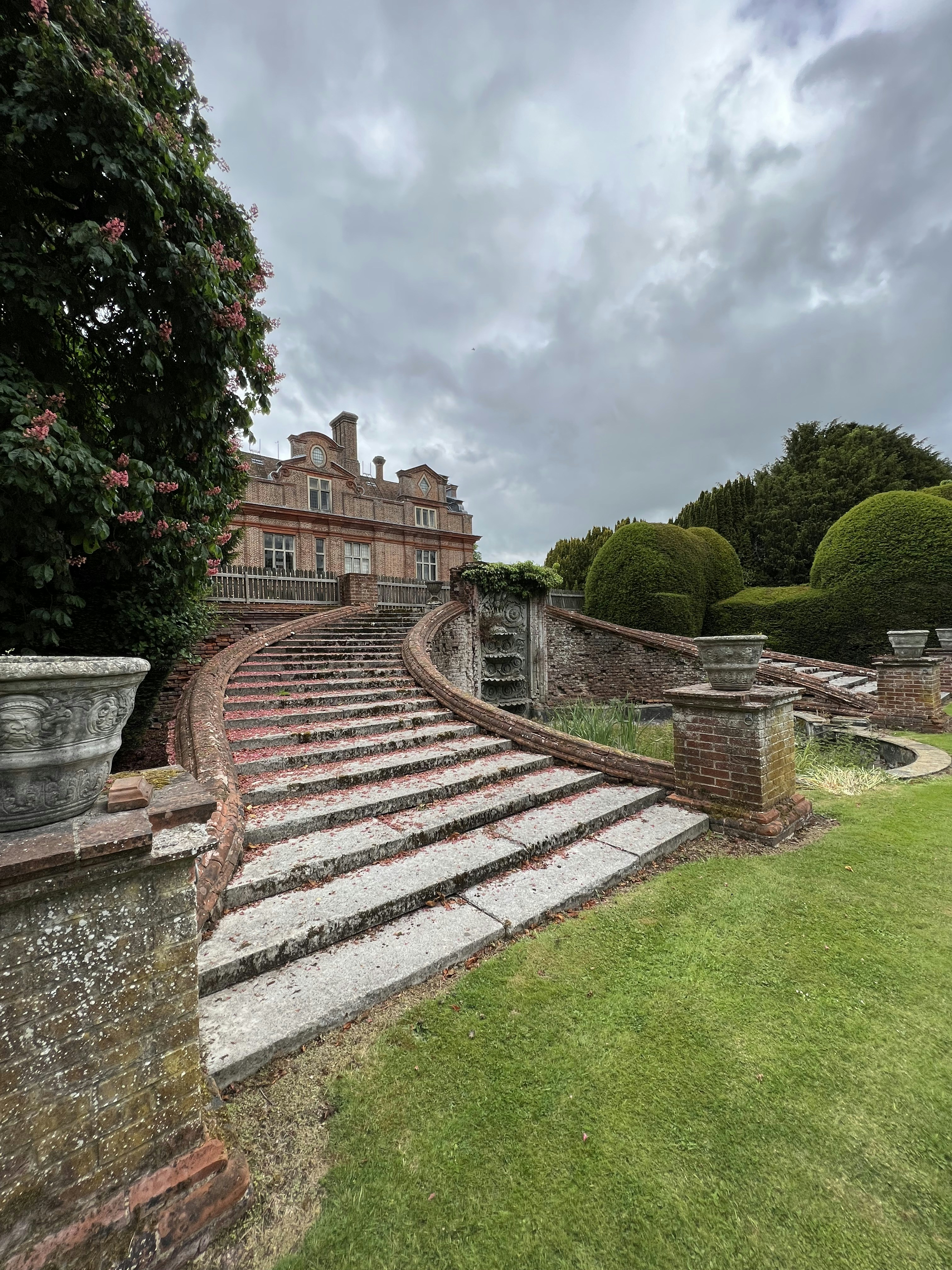 curved twin stairways are lying down through old stone mansion