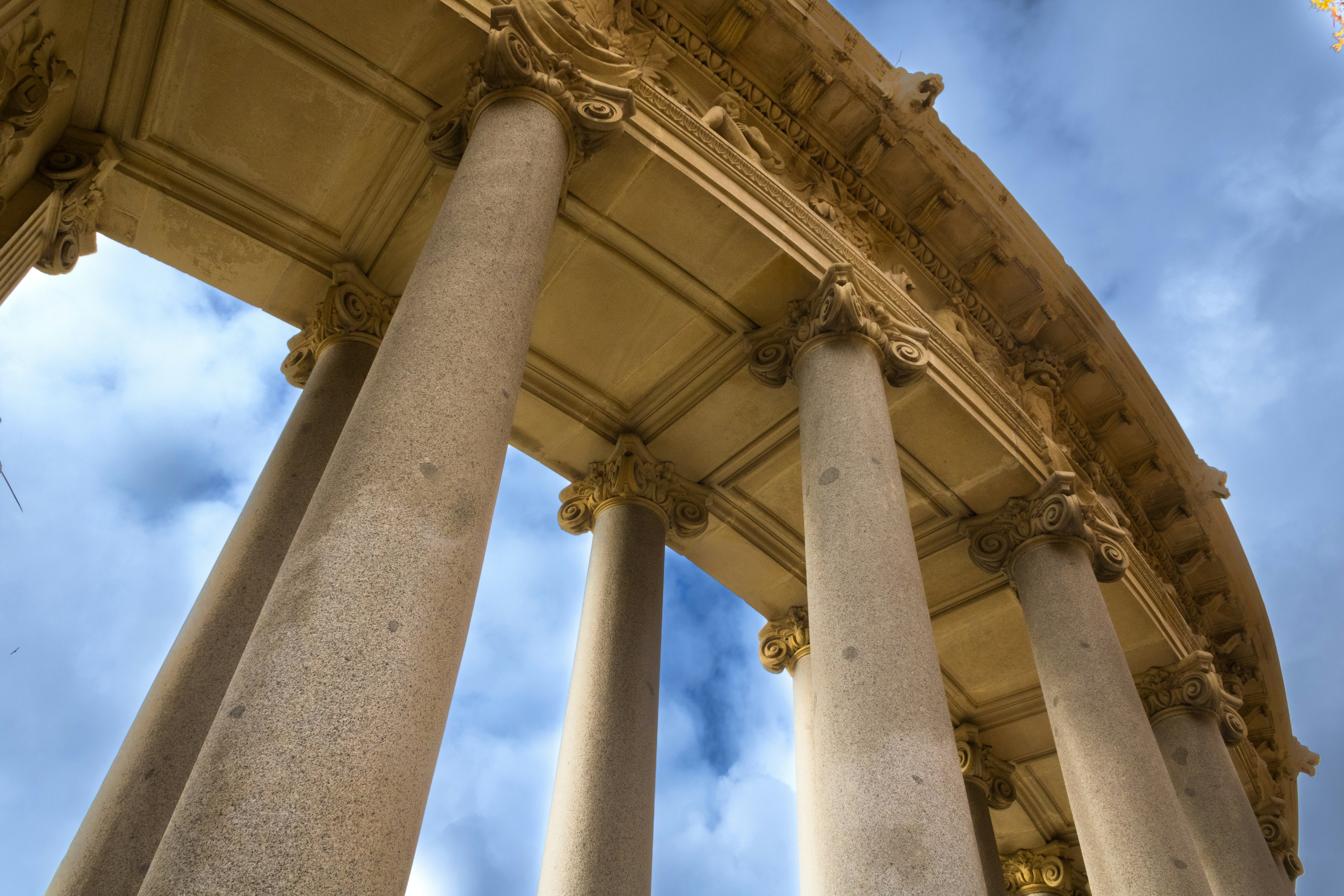 A group of pillars with a sky in the background photo – Free Spain ...