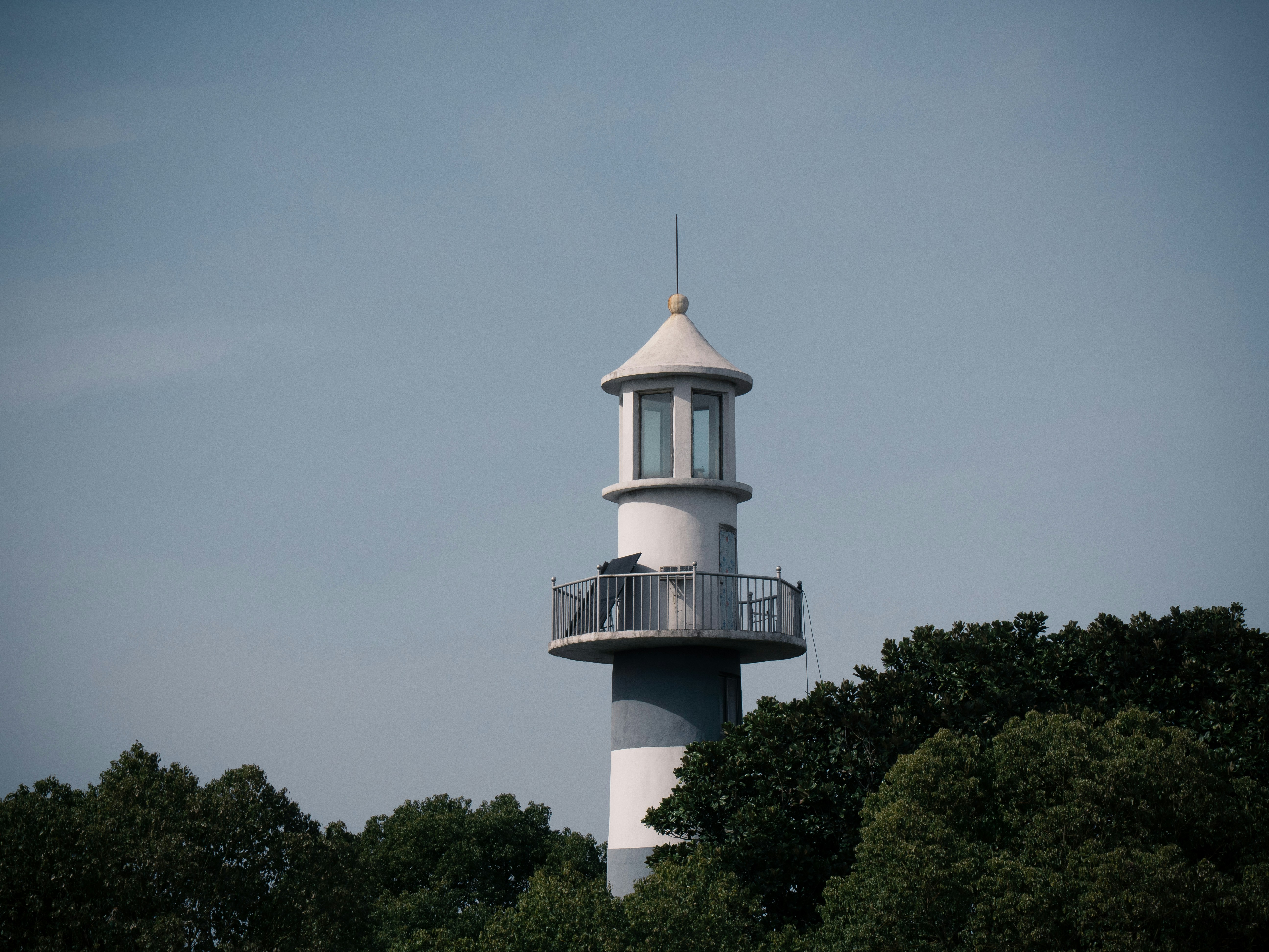 A white and gray lighthouse with a balcony photo – Free Lighthouse ...