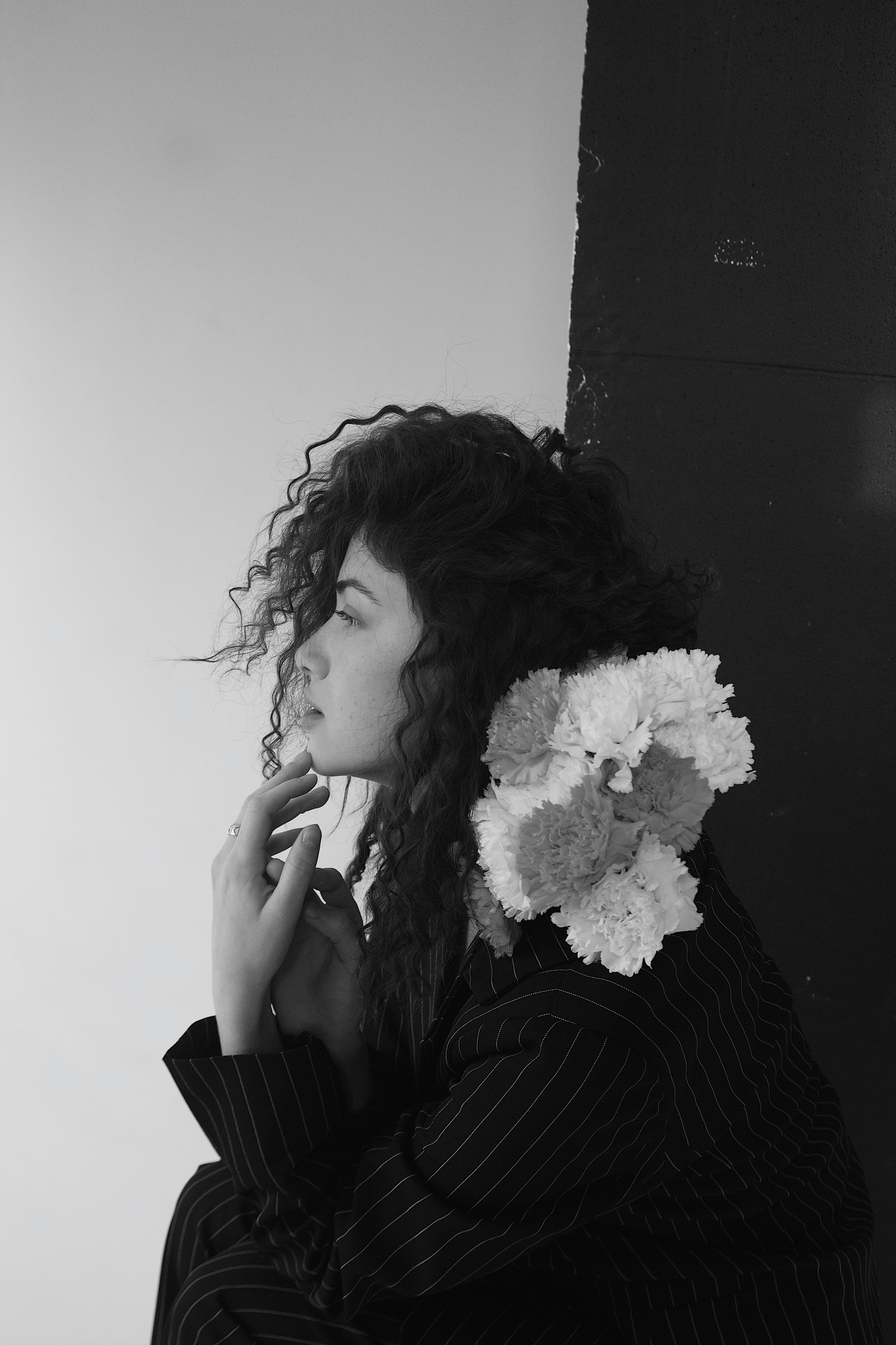 A woman with curly hair smoking a cigarette photo – Free Flower Image ...