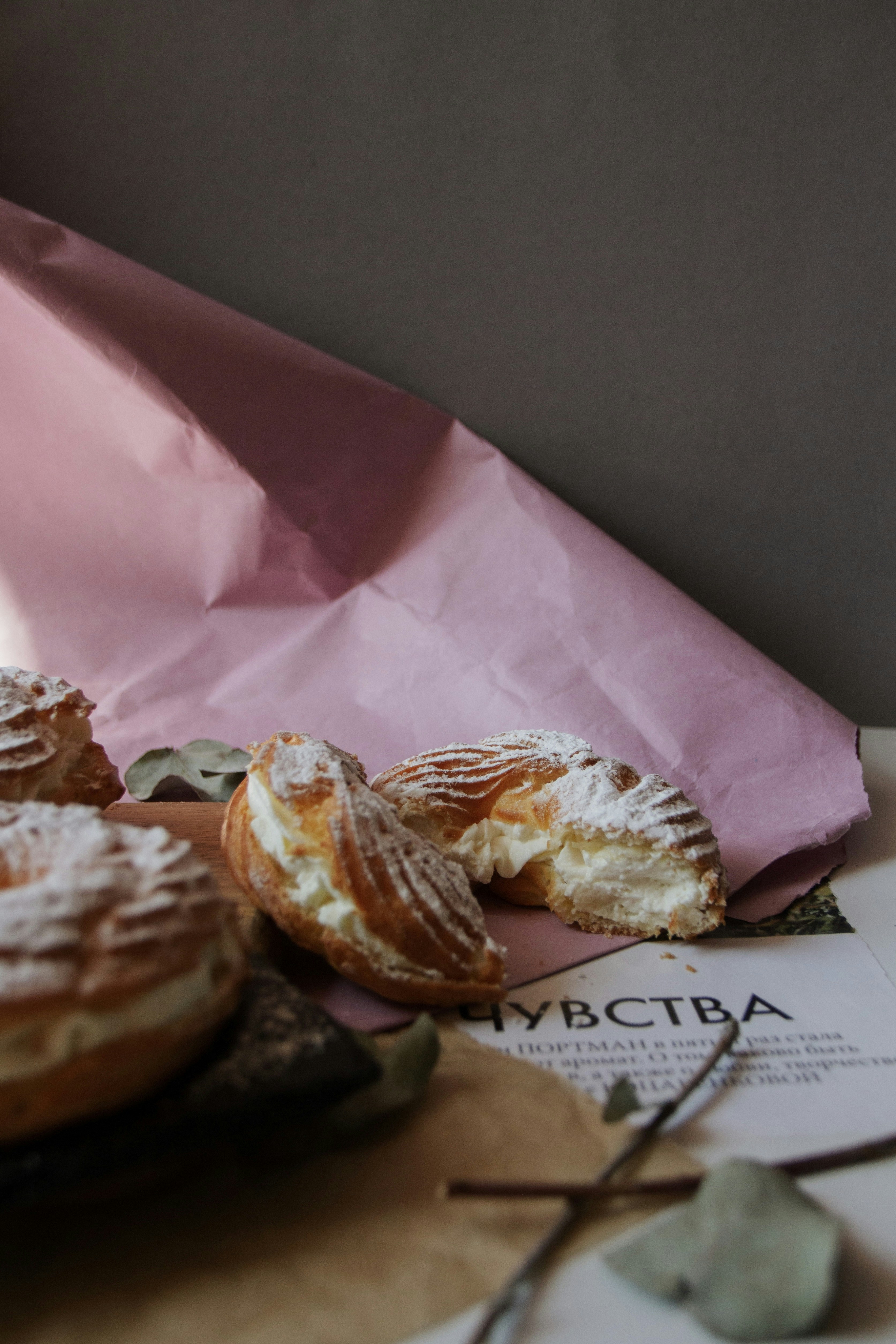 A table topped with pastries covered in powdered sugar photo – Free ...