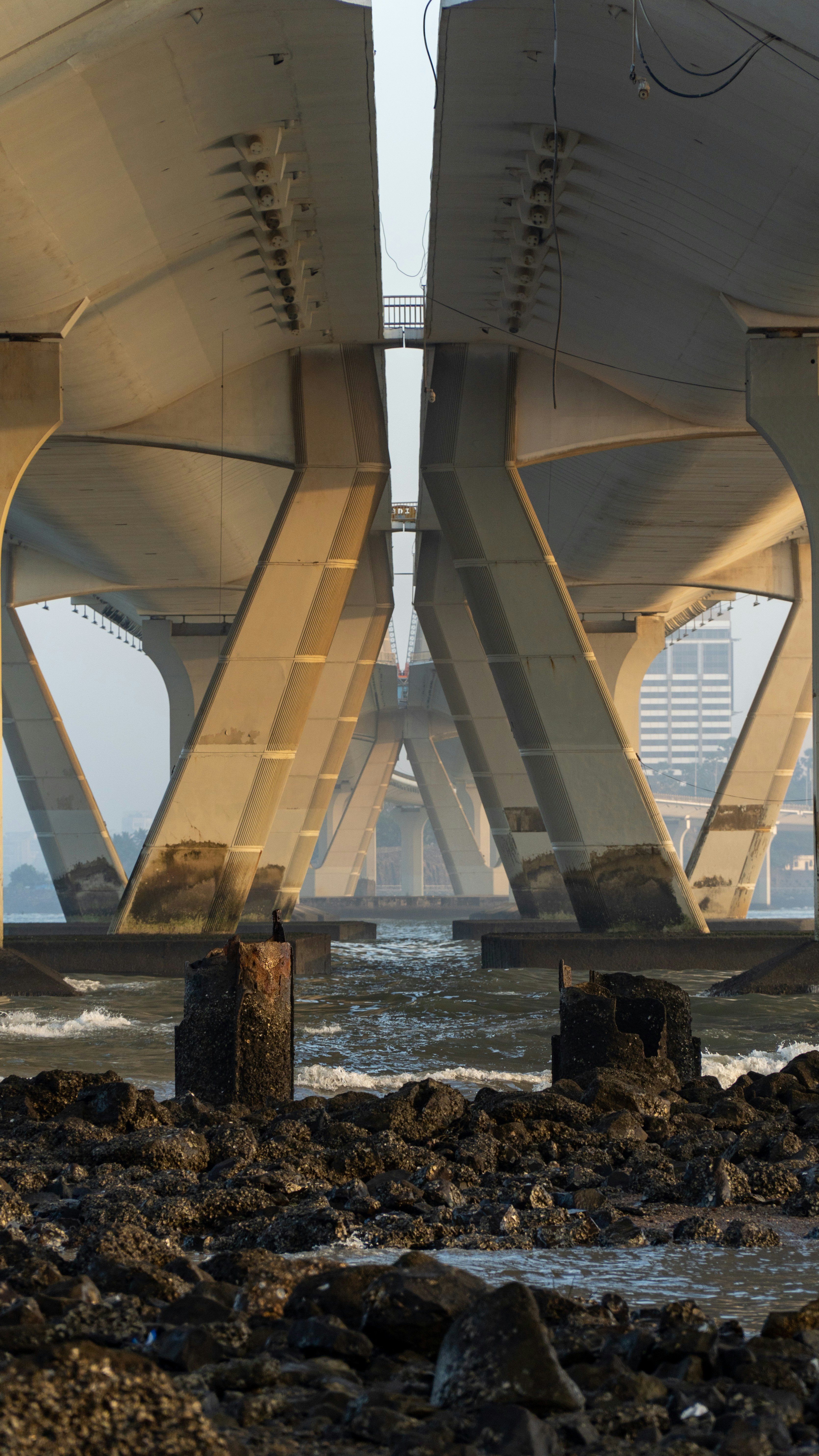The underside of a bridge over a body of water photo – Free Road Image ...