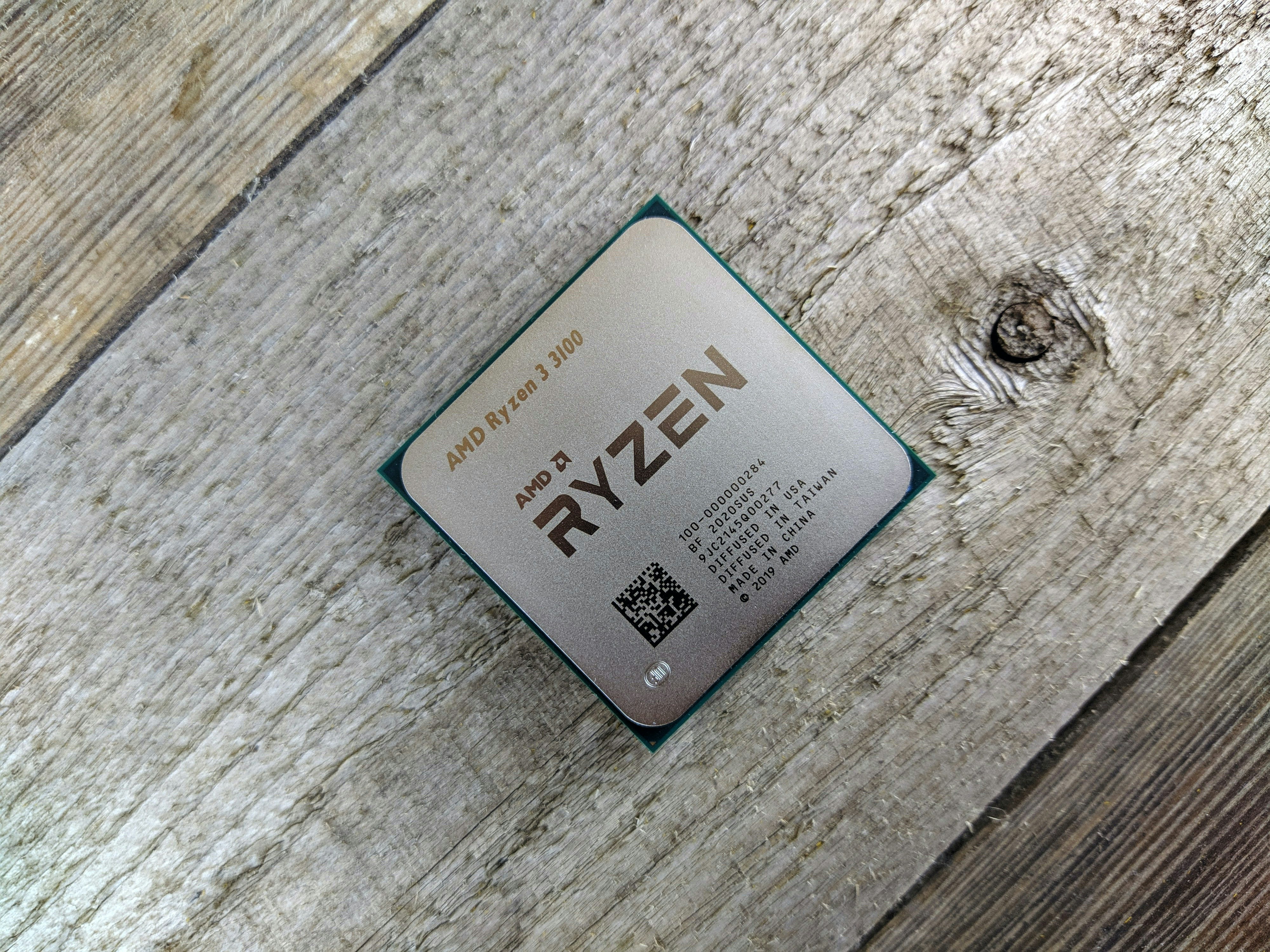 A close up of a cpu on a wooden surface photo – Free Cpu Image on Unsplash