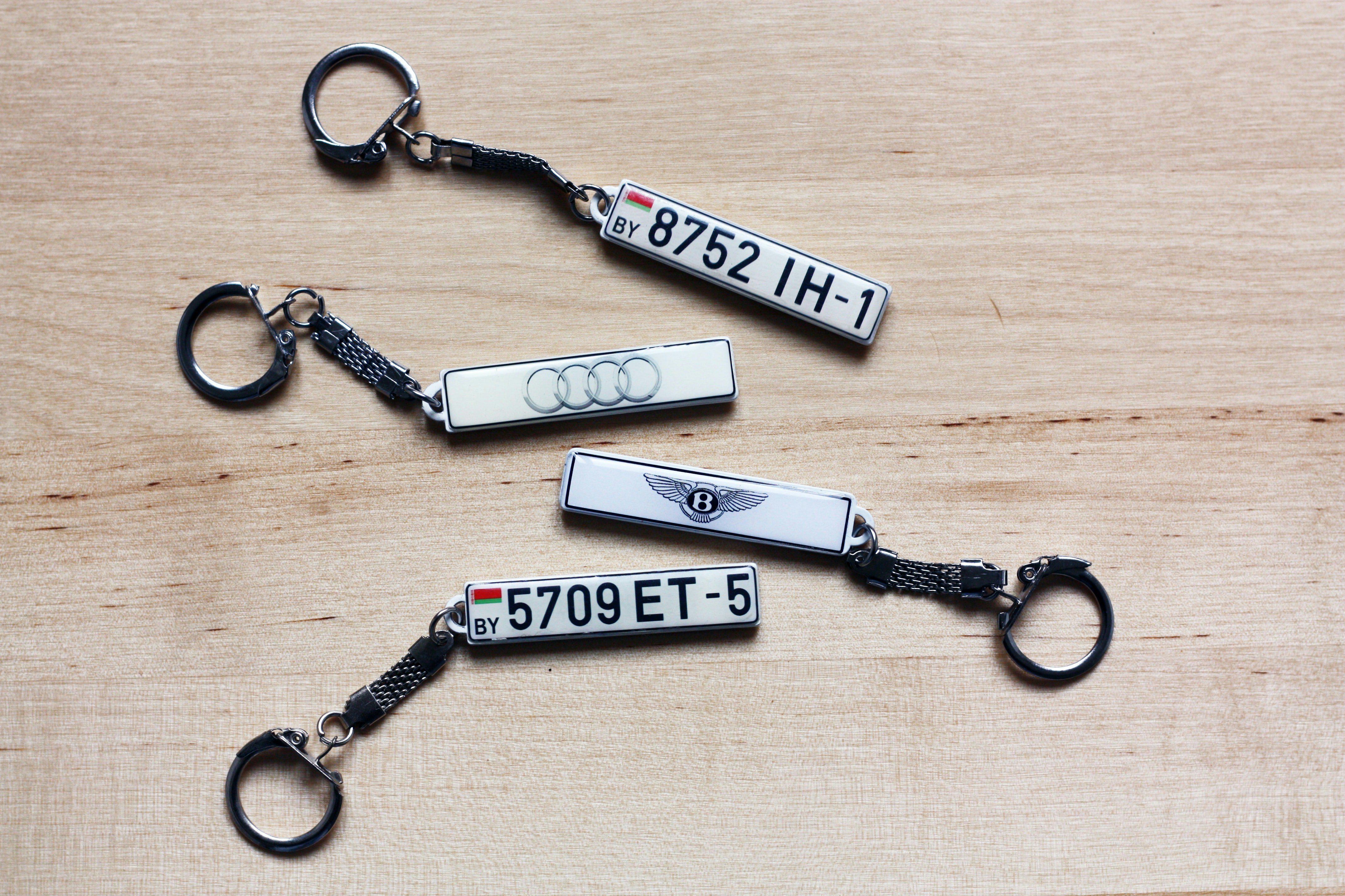 Three keychains with the number five and the number five on them photo ...