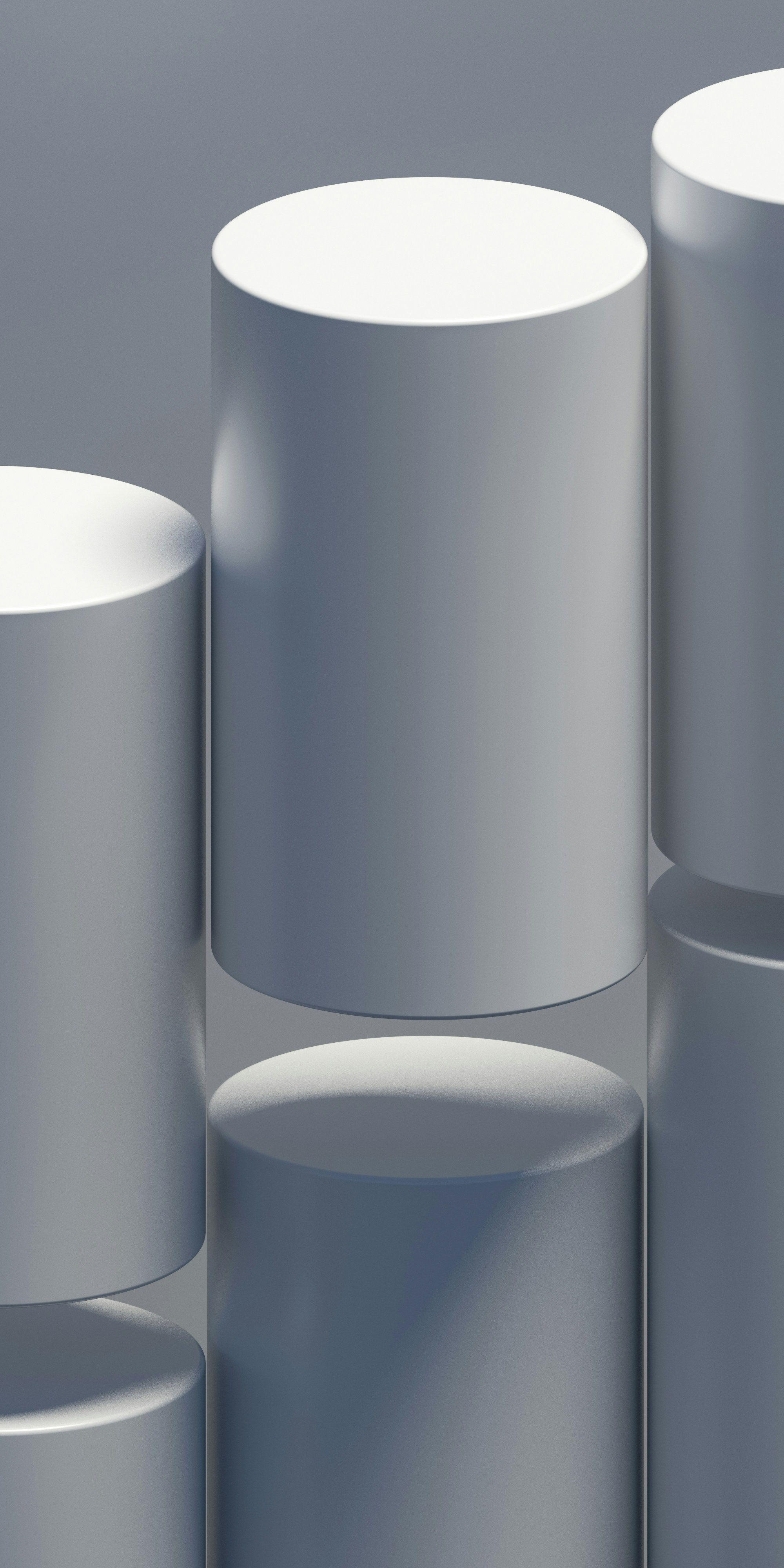 A group of white cylindrical objects sitting next to each other photo ...