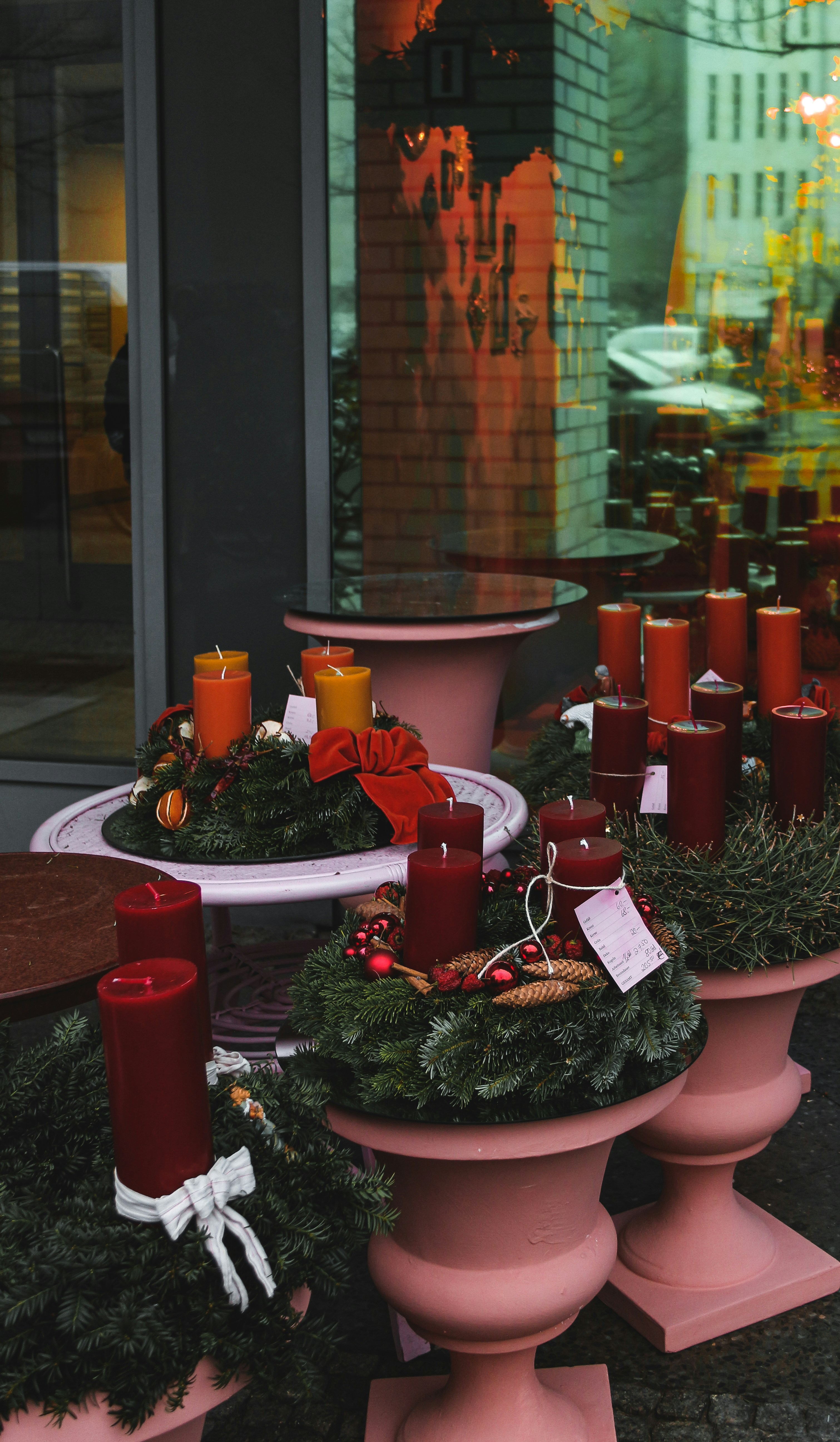 Festival of Red Candles: A Corner of Holiday Arrangements in Pink Pedestals