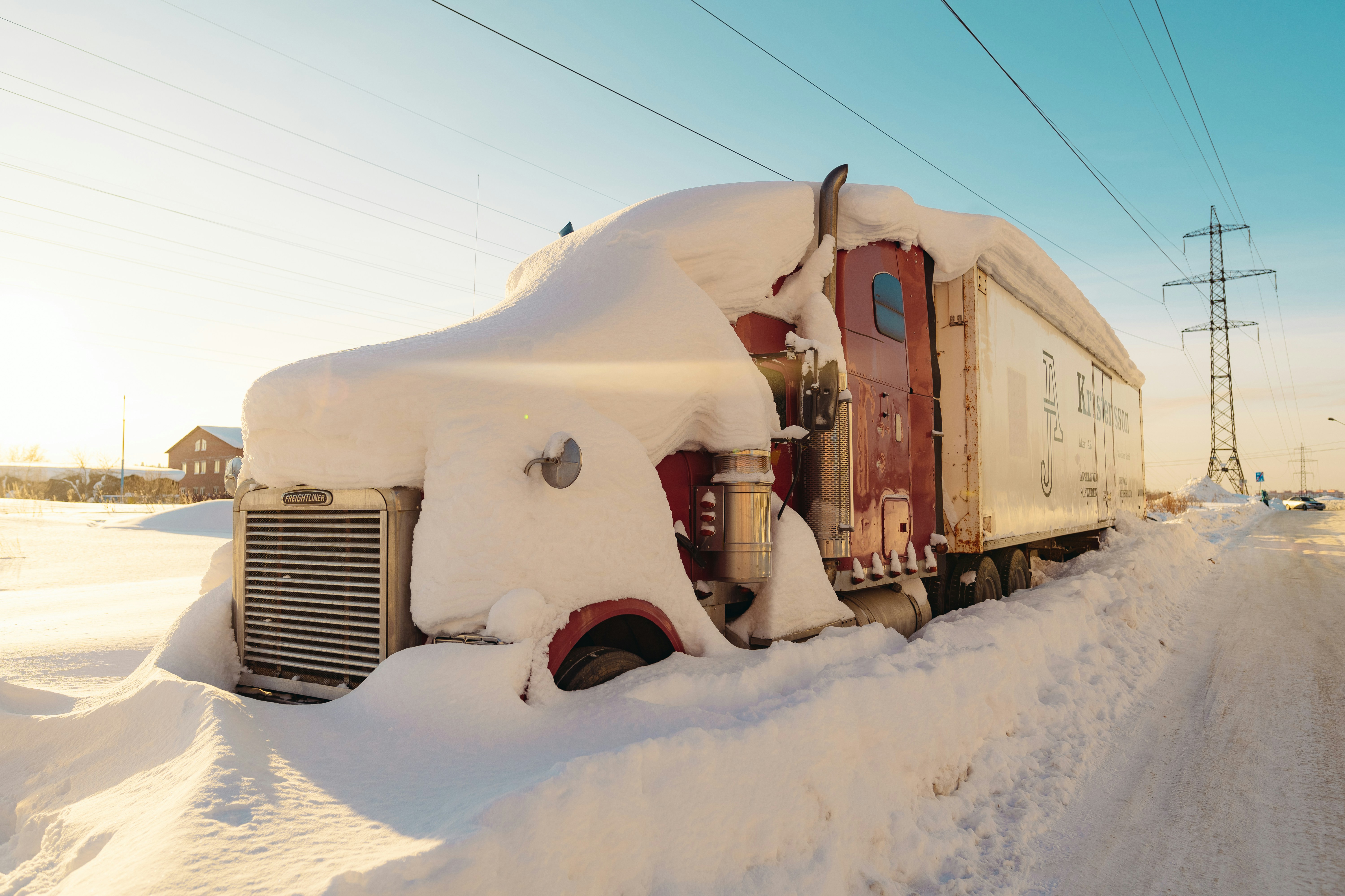 Red Locomotive Half-Buried in a Quiet Snowfield