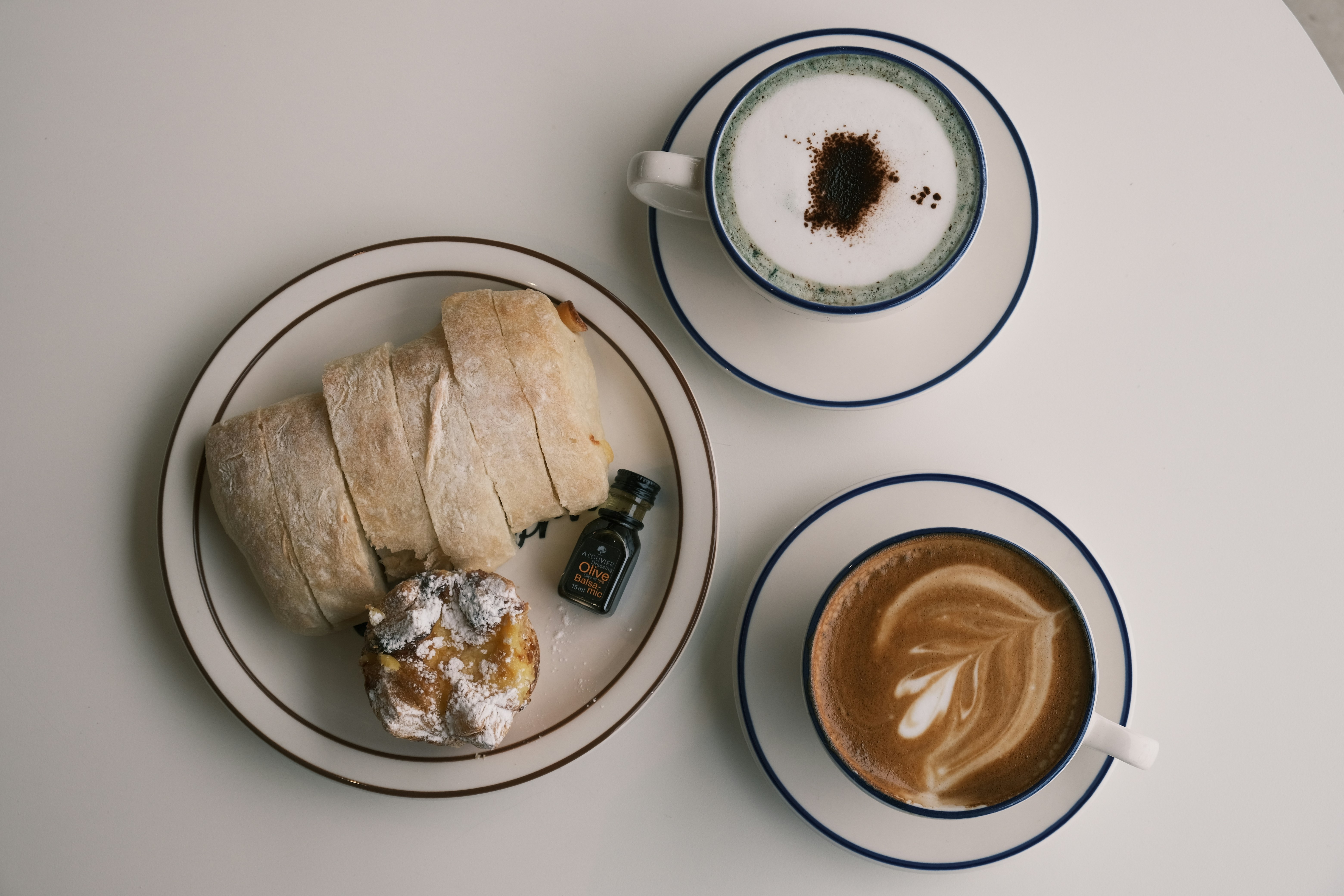 a plate of food next to a cup of coffee