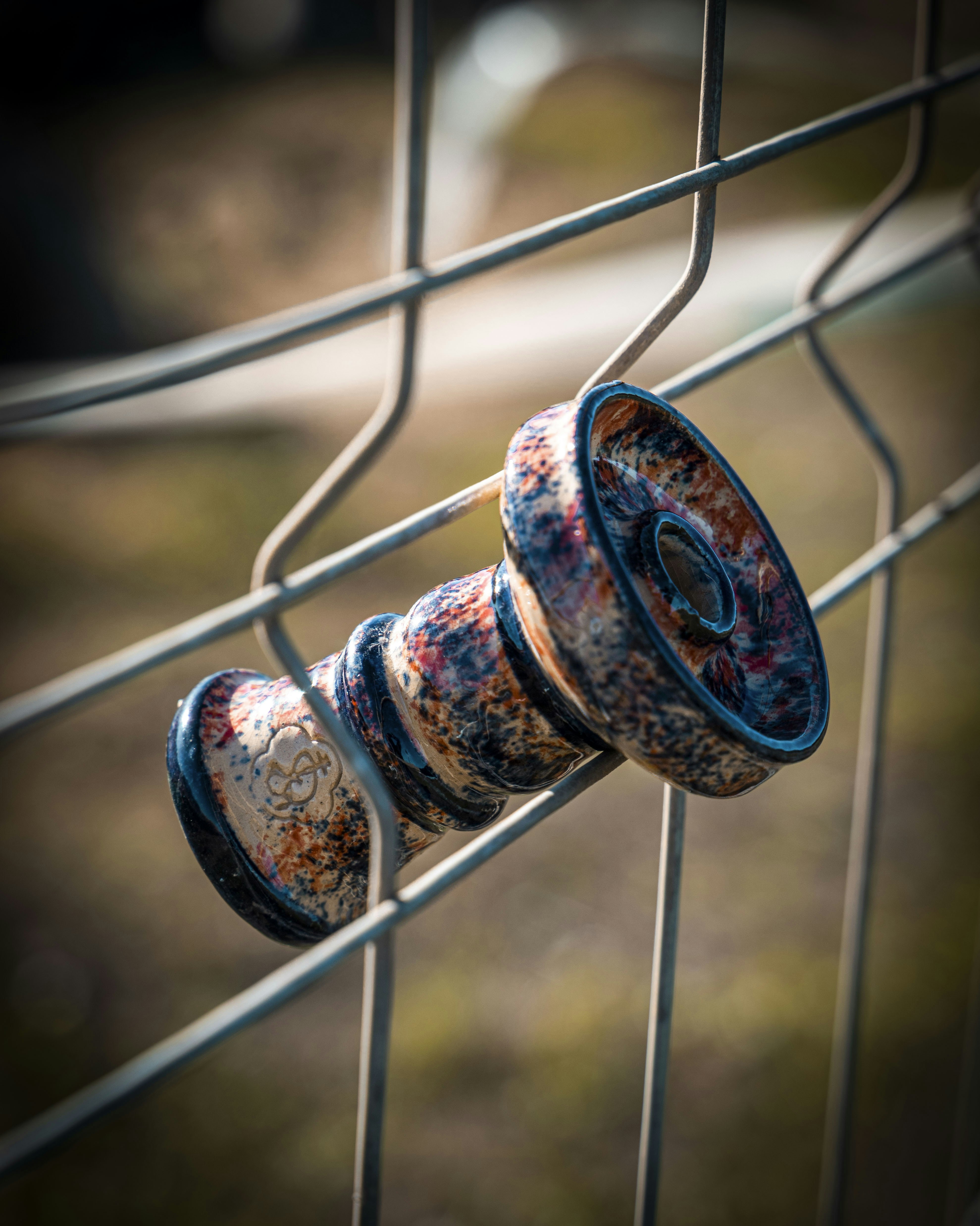 A close up of a metal fence with two knobs photo – Free Tomahawk bowl ...