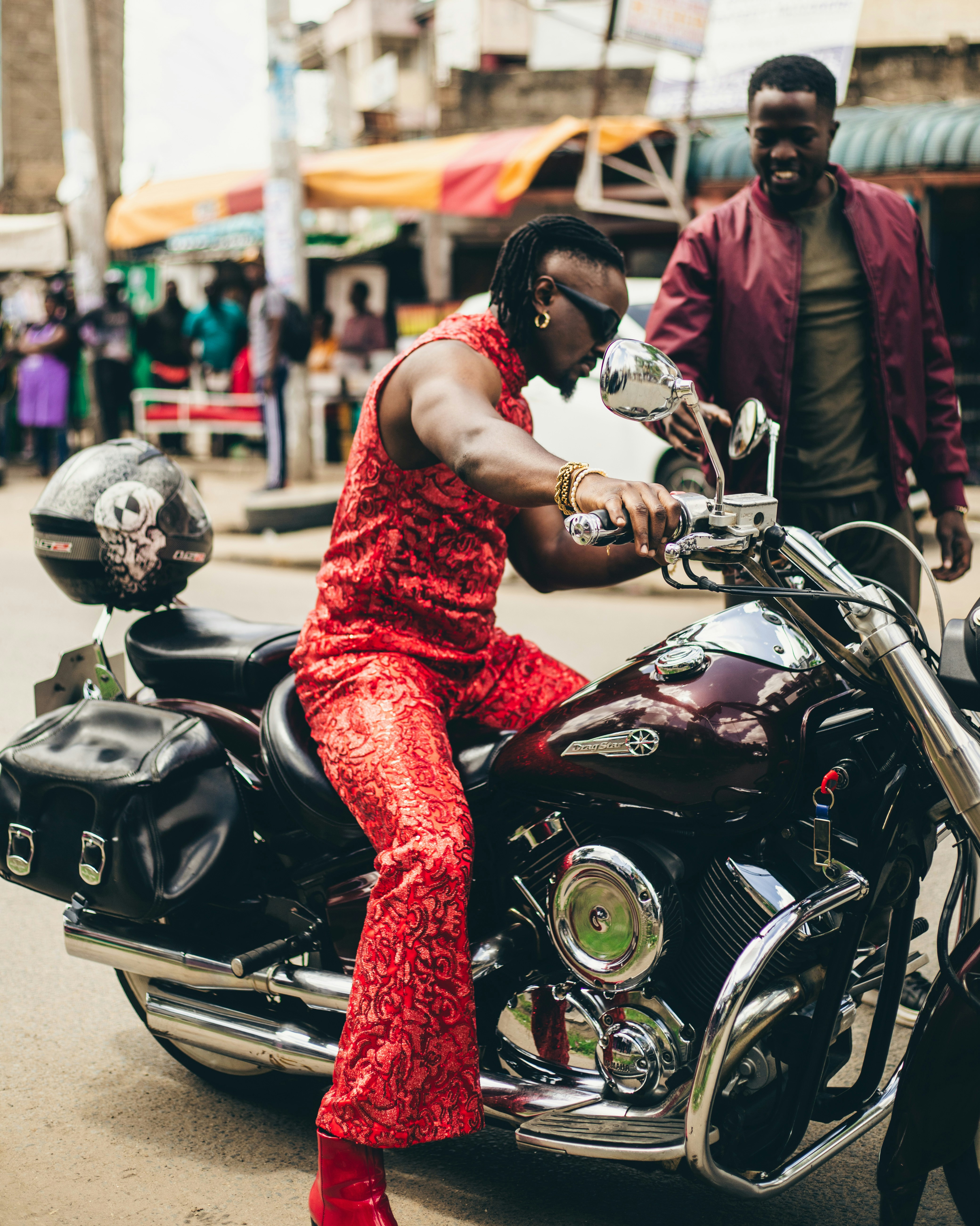 A woman in a red dress sitting on a motorcycle photo – Free Woman Image ...