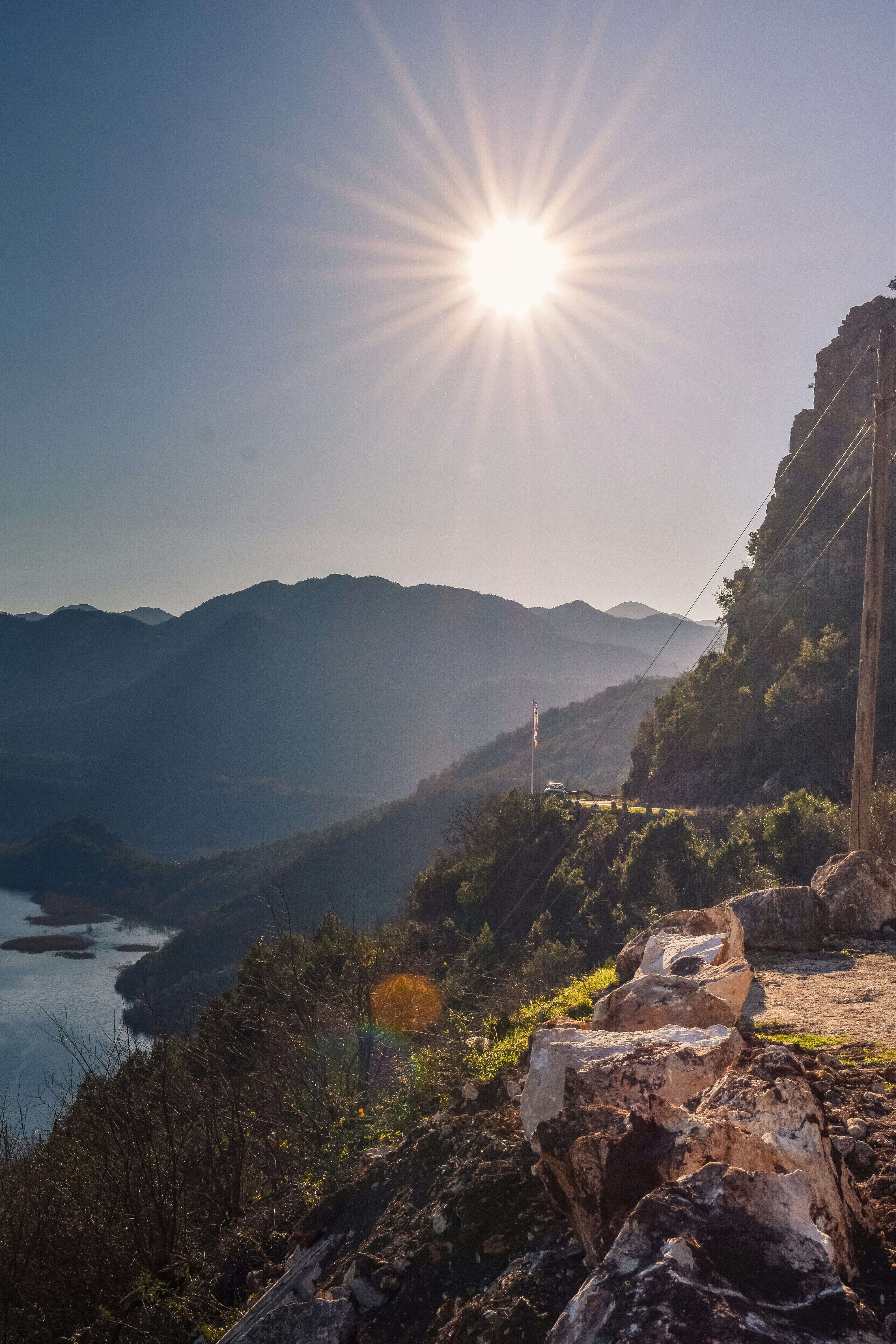 Sunlit Ridge: A Coastline Valley Unfolds Beneath a Radiant Peak