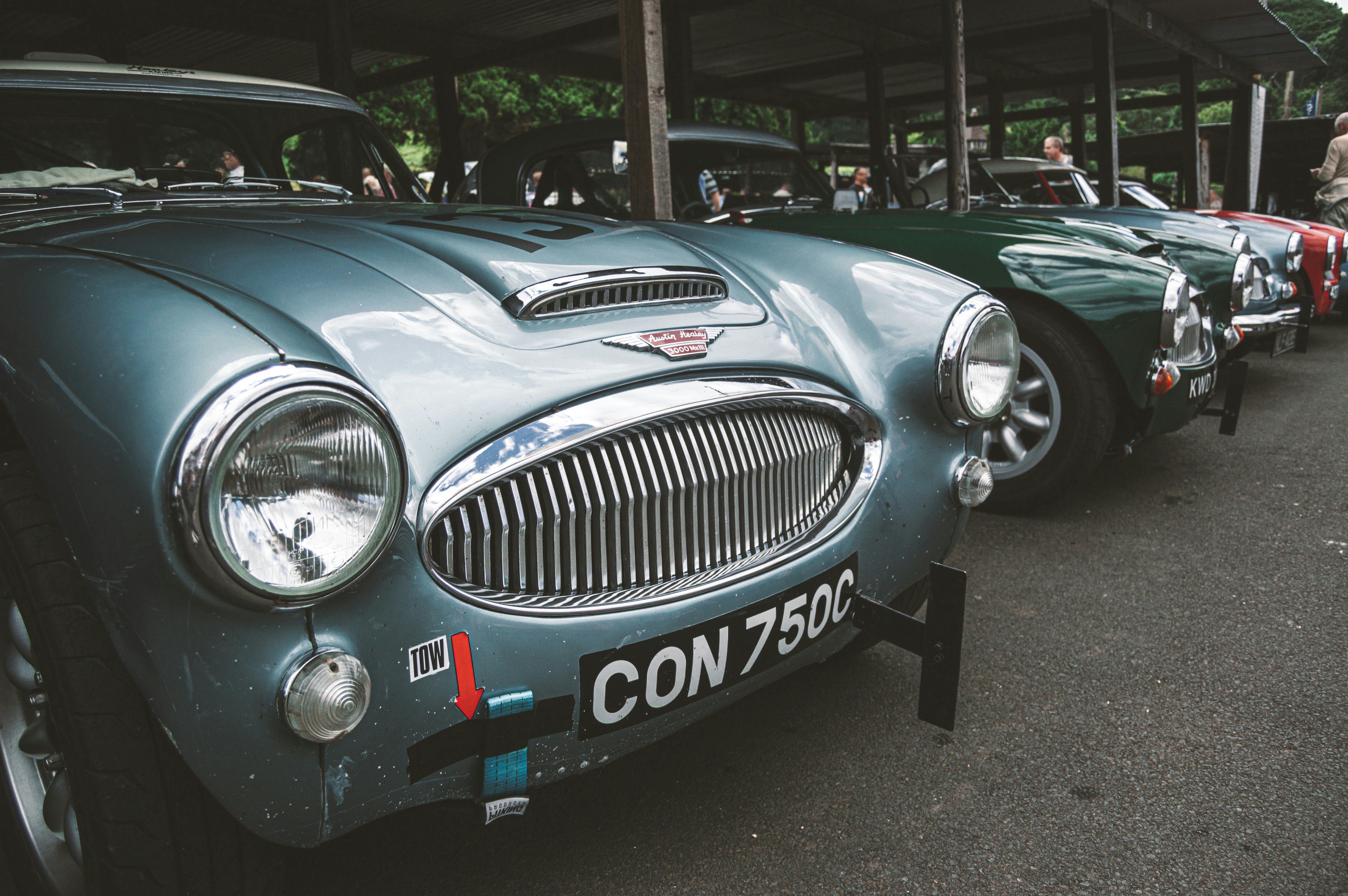 A row of vintage cars parked next to each other photo – Free Car Image ...