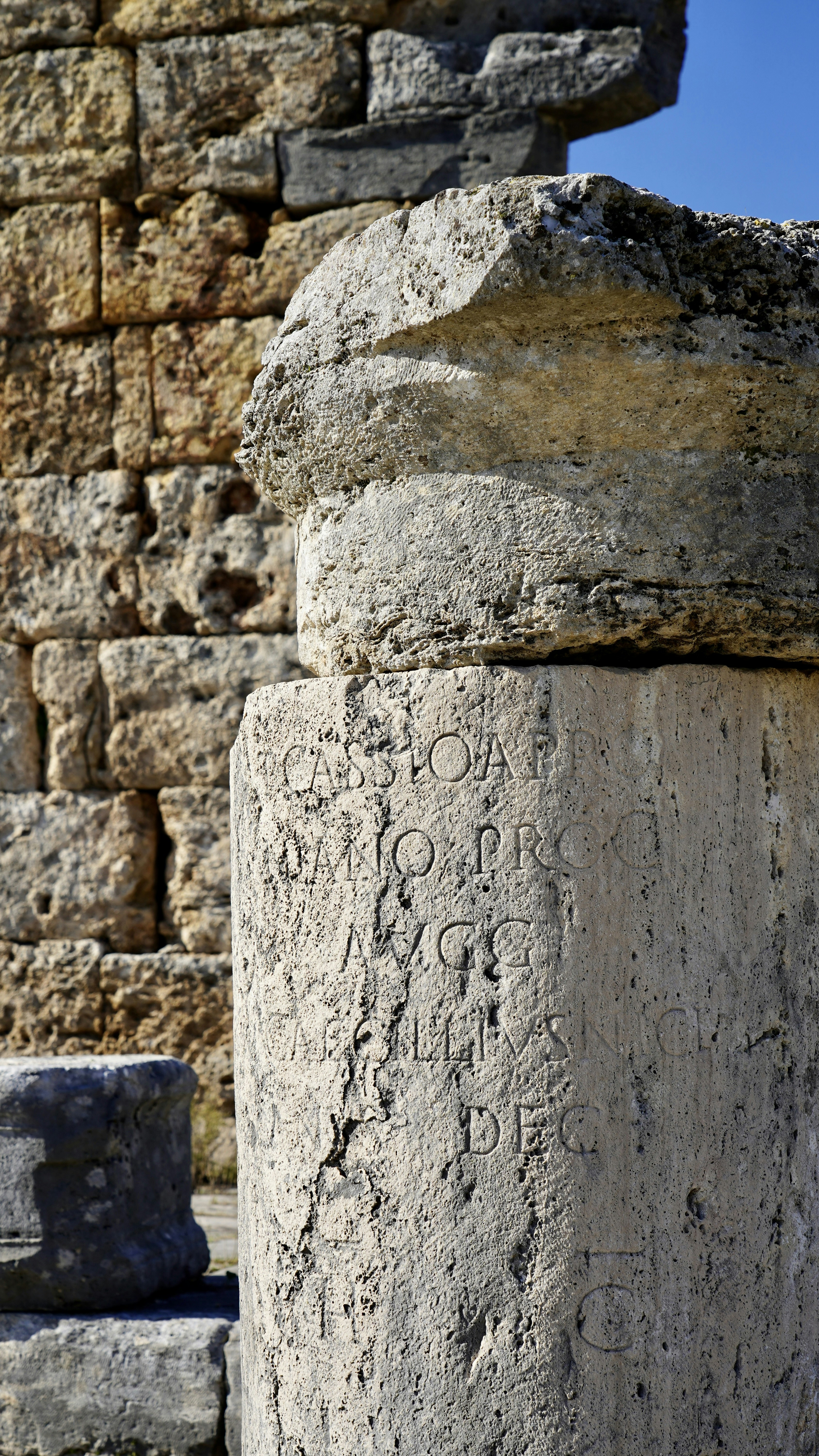A close up of a stone pillar with writing on it photo – Free Wall Image ...