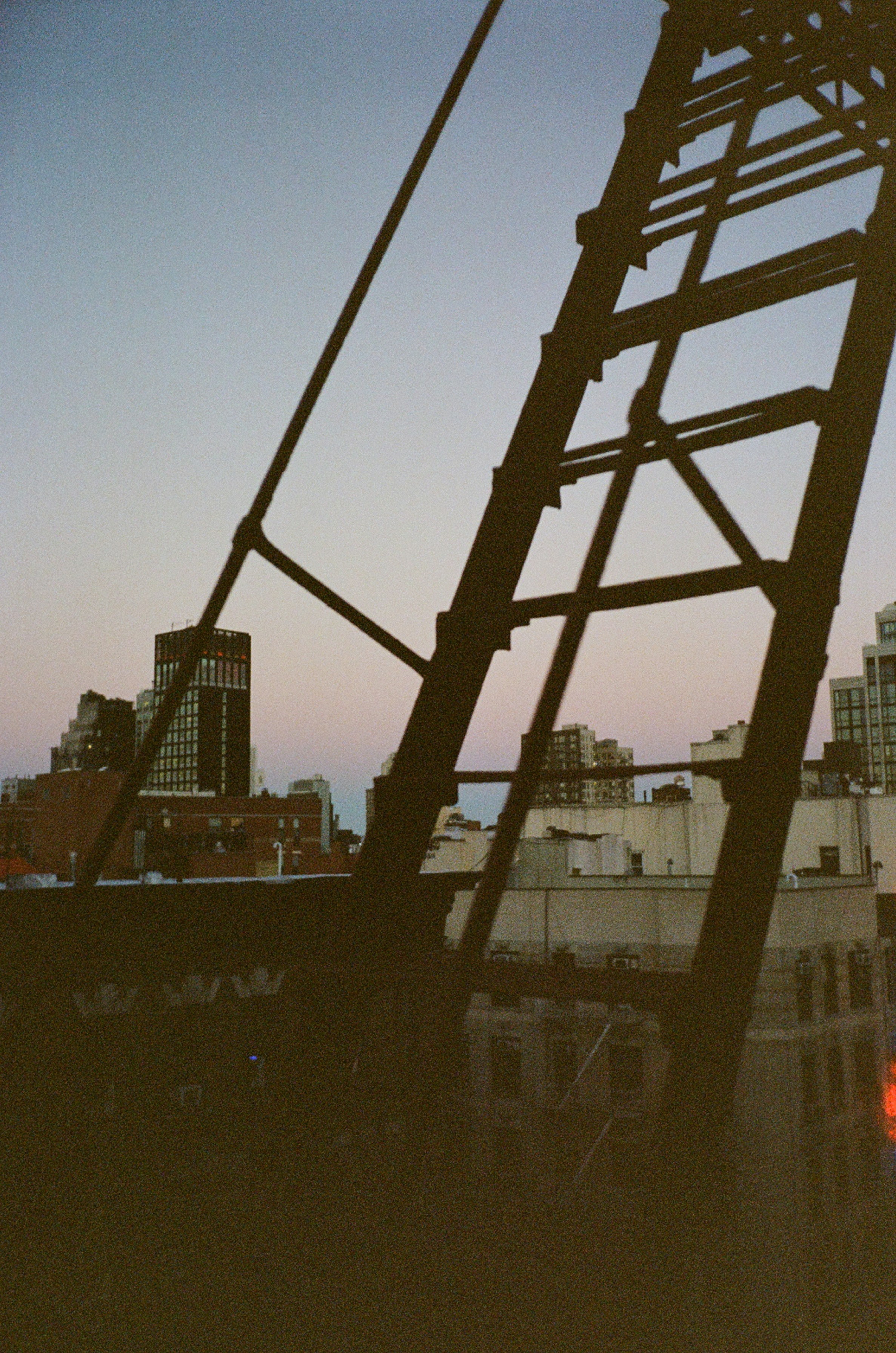 A tall metal structure with a city in the background photo – Free New ...