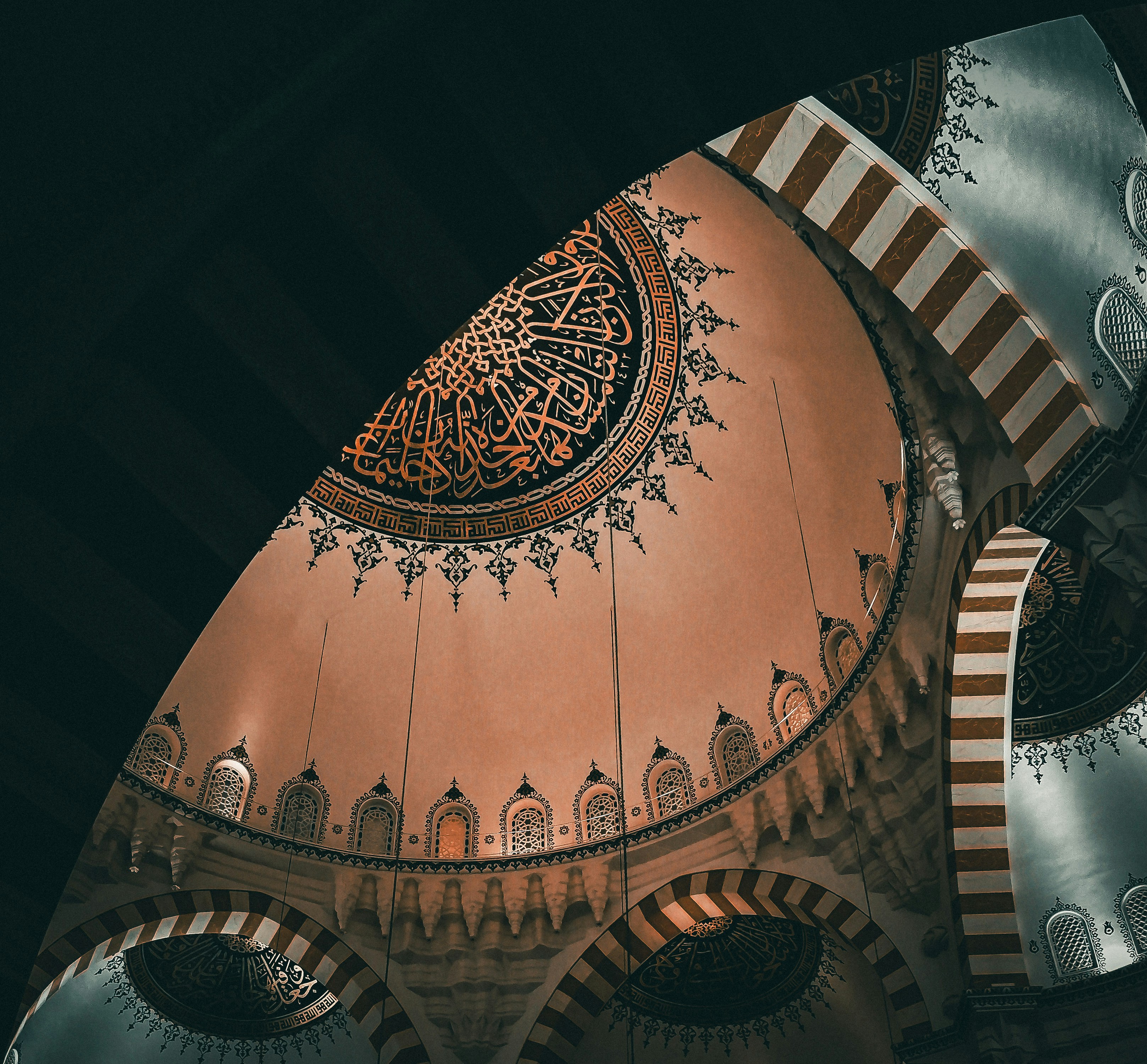 Medallion of Light: Dome Details Framed by Striped Arches