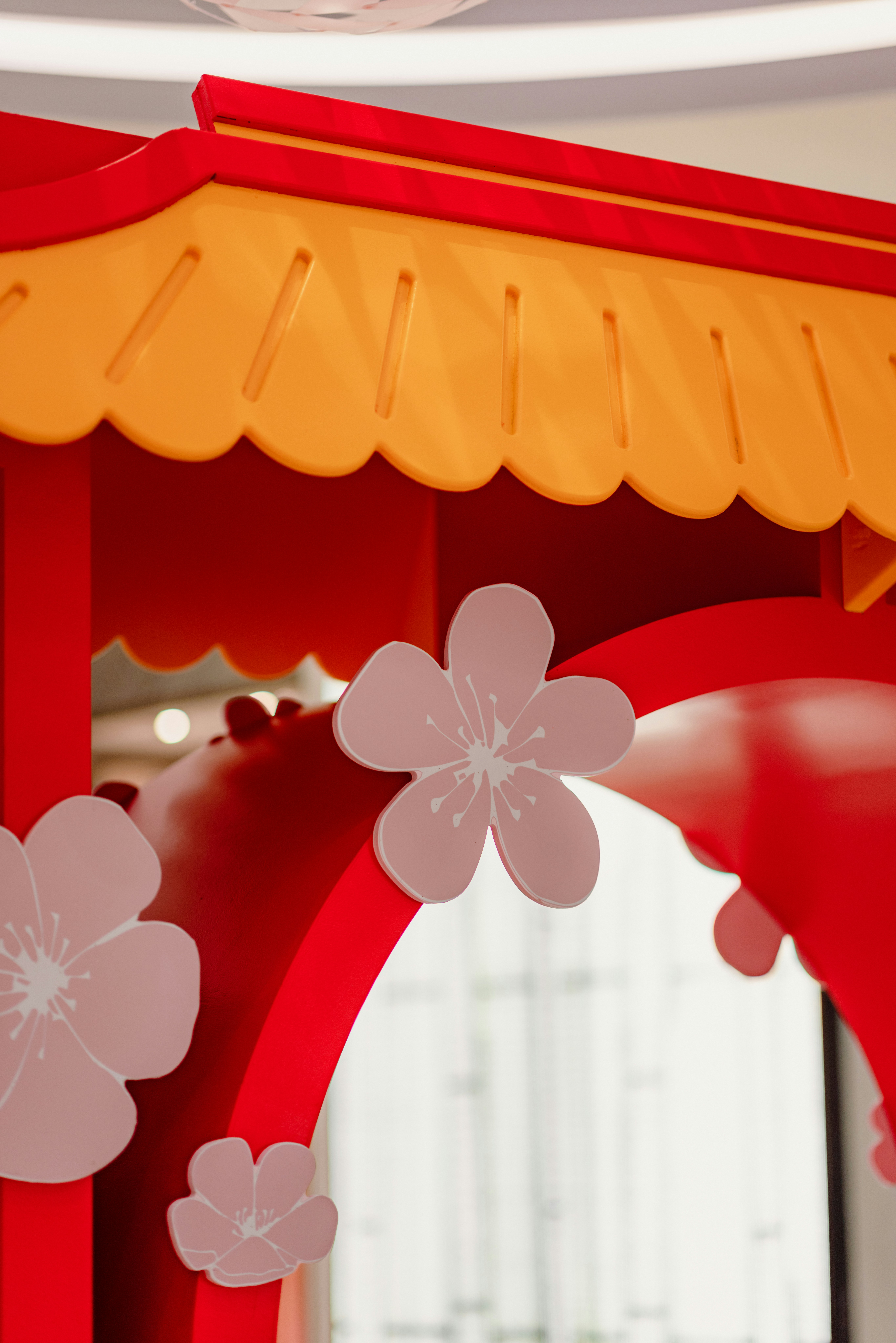 Red Lantern Arch with Pale Flower Ornaments