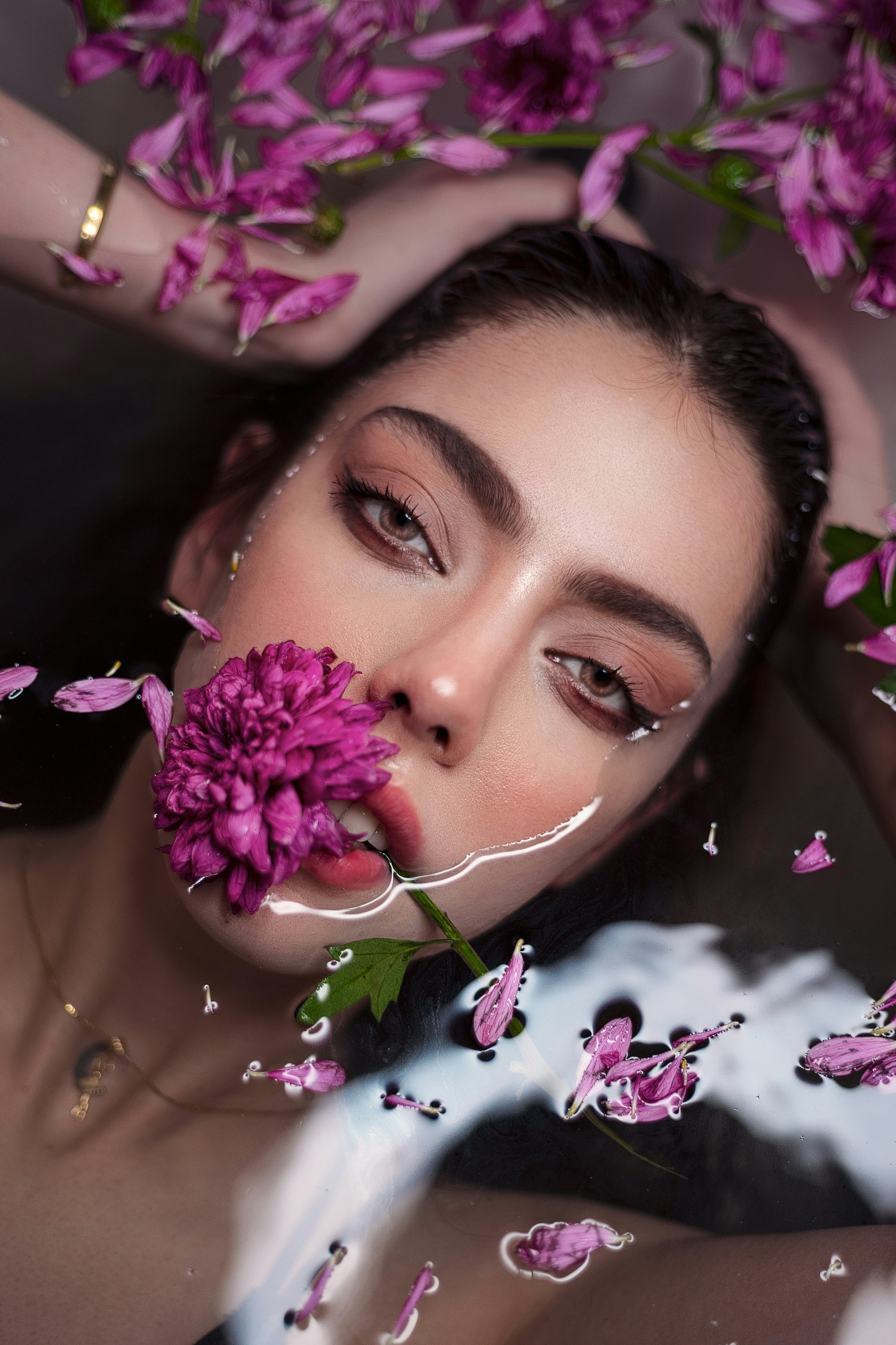 A woman with a flower in her mouth photo – Free Flower Image on Unsplash