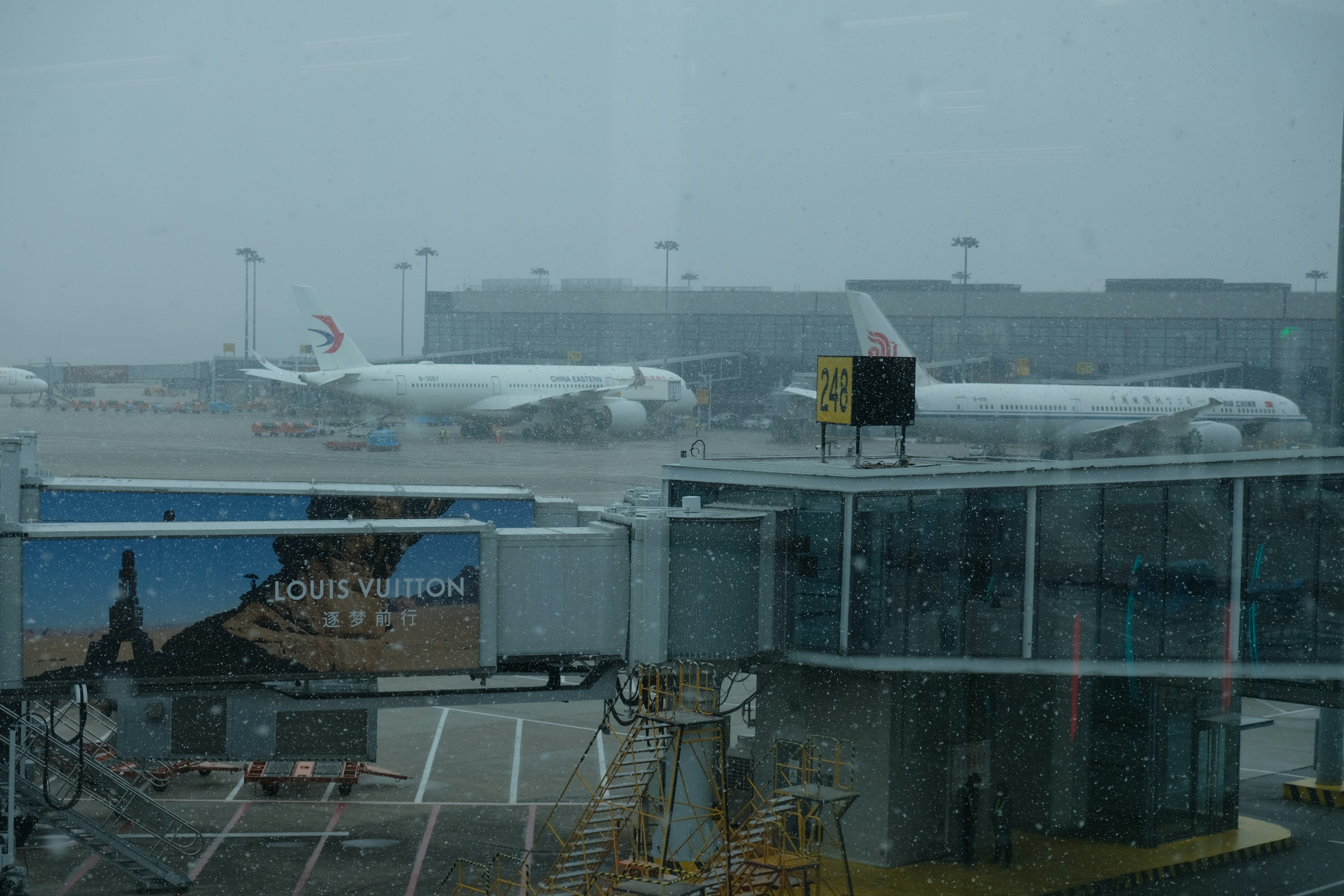 A view of an airport through a window photo – Free Shanghai hongqiao ...